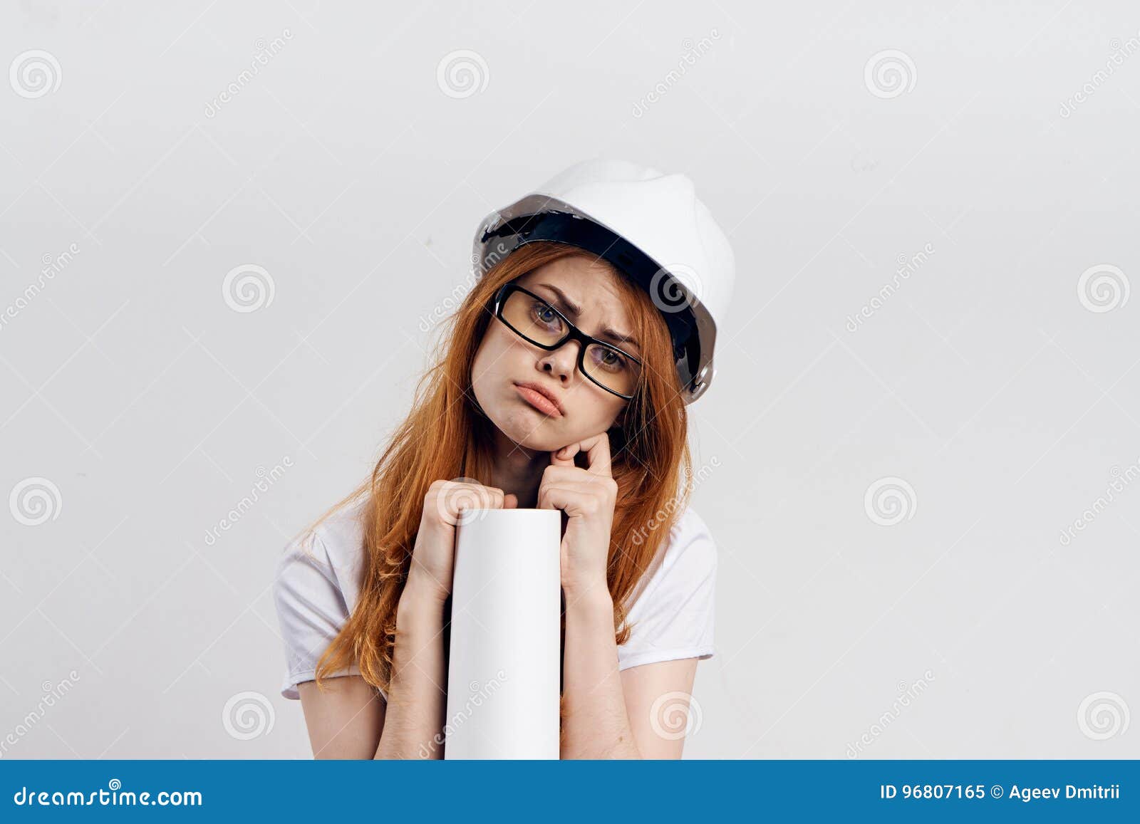 Young Beautiful Female Engineer on White Background Holds Blueprints ...
