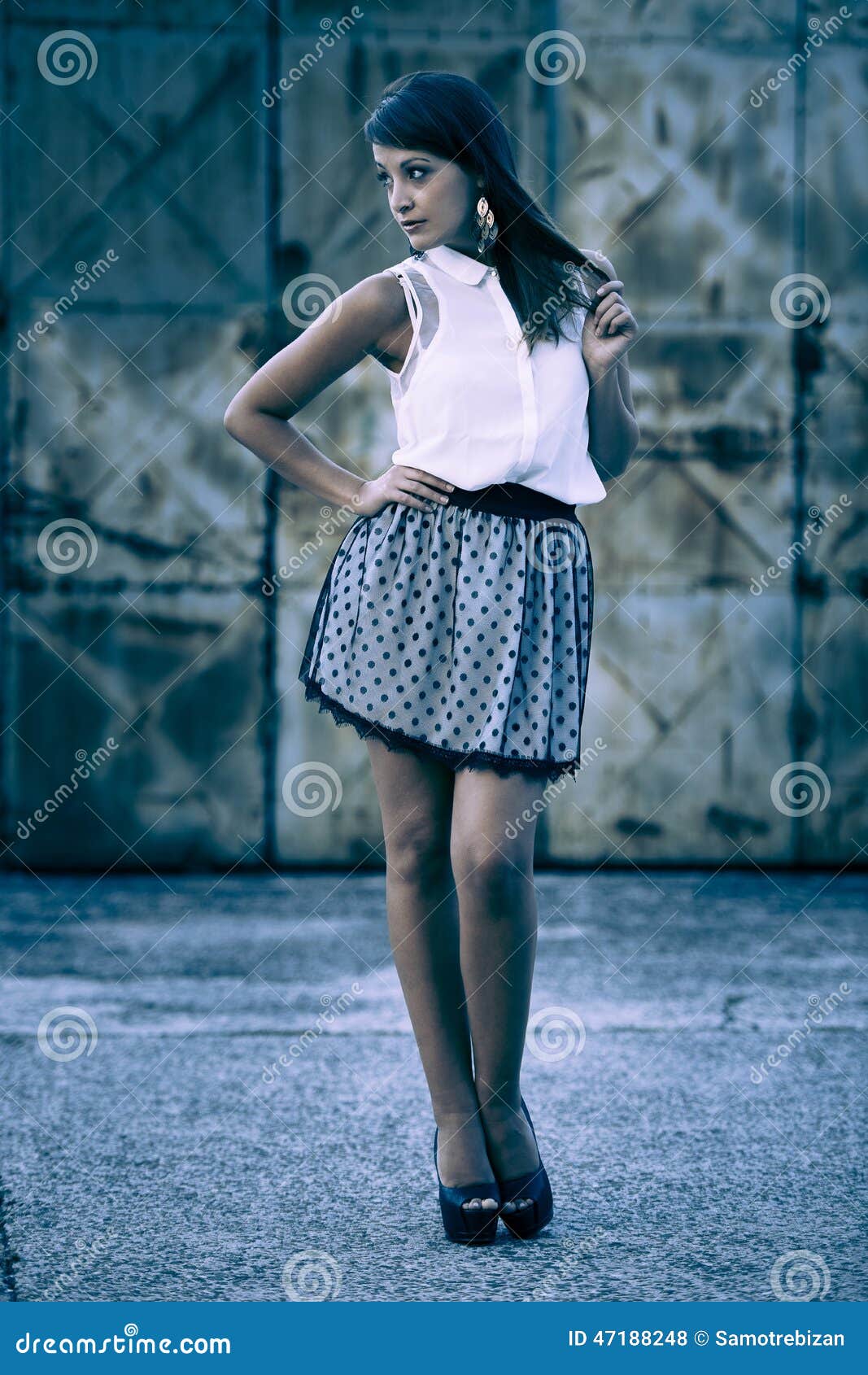 Young Beautiful Female Model Standing in Front of the Old Rusty Stock ...