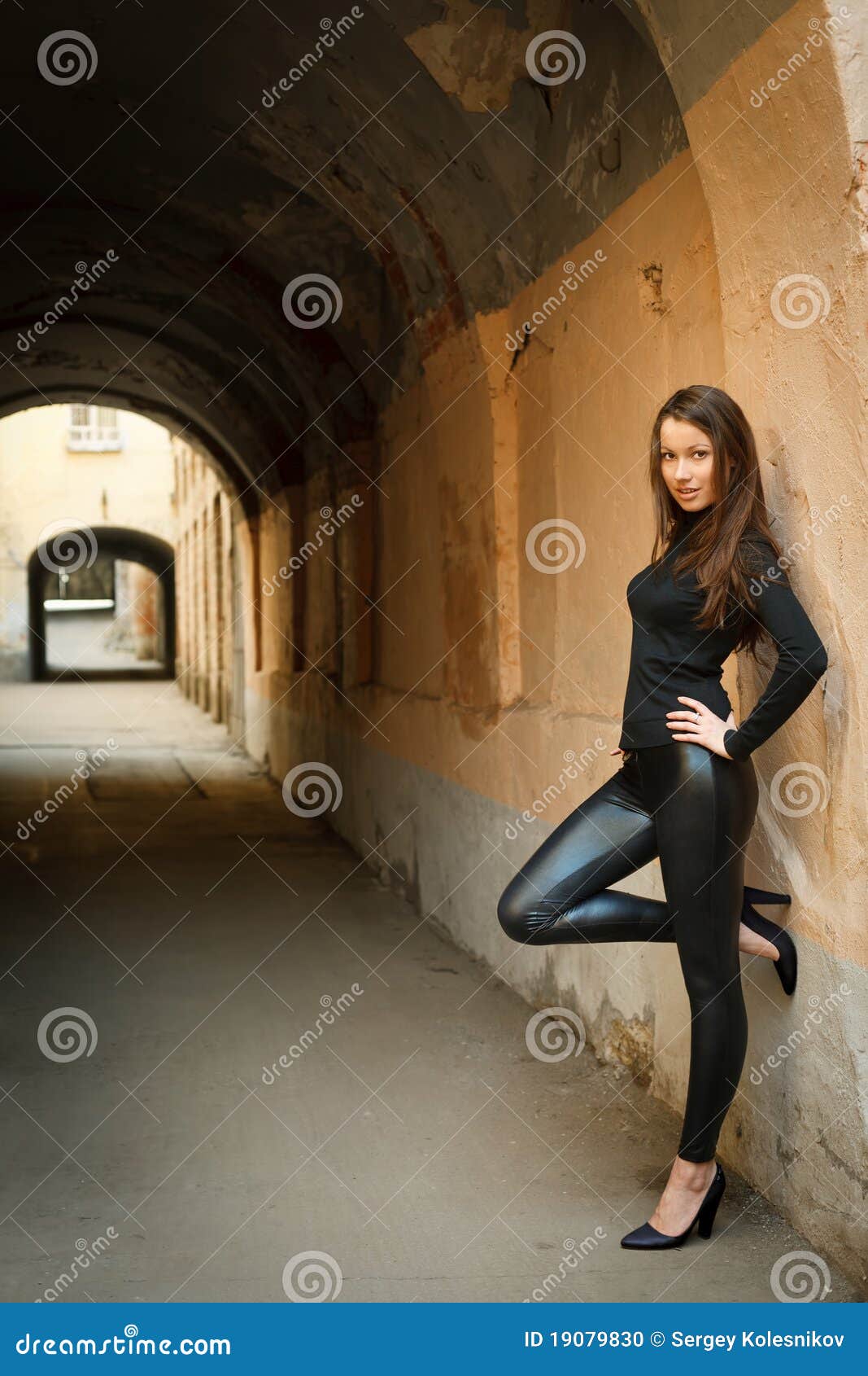 Young Beautiful Female Model Standing Near Wall Stock Photo - Image of ...