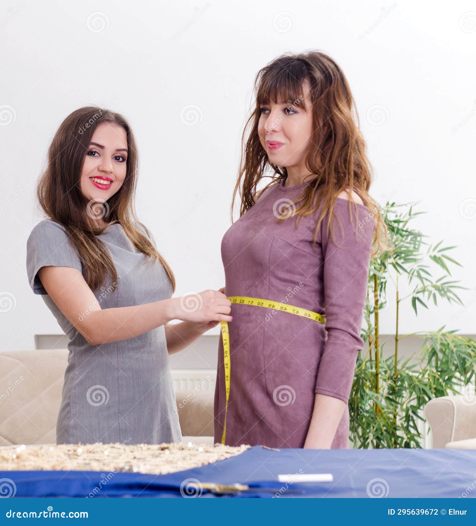 Young Beautiful Female Tailor Taking Measurements Stock Photo - Image ...