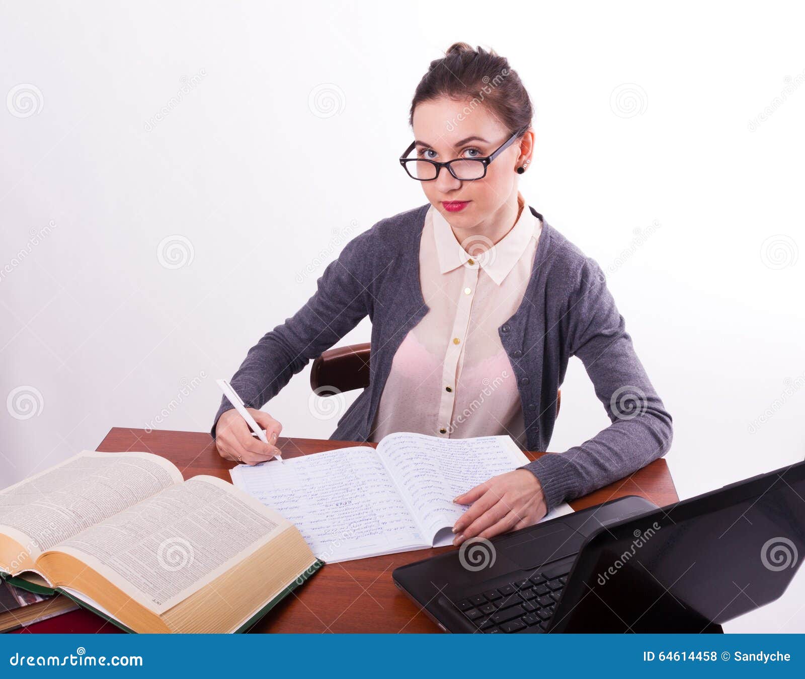 Young Beautiful Female Teacher Sitting at a Table Stock Photo - Image ...