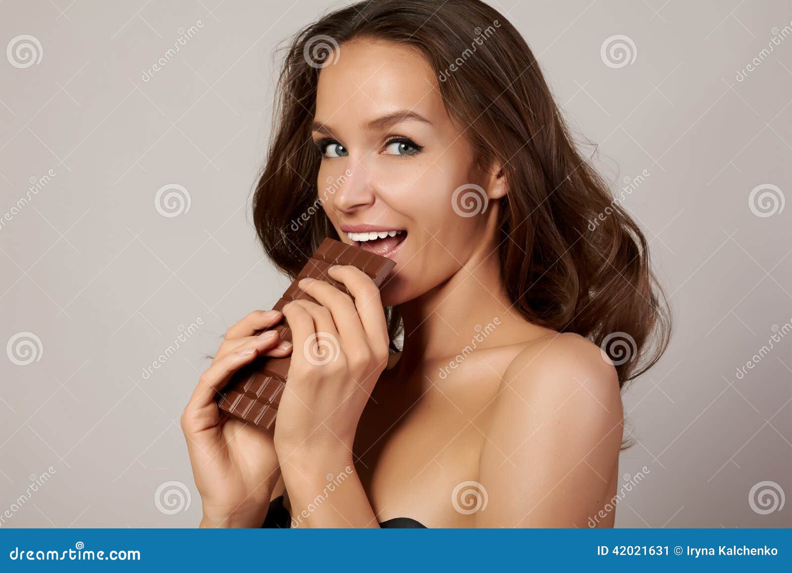 Young Beautiful Girl With Dark Curly Hair Bare Shoulders And Neck