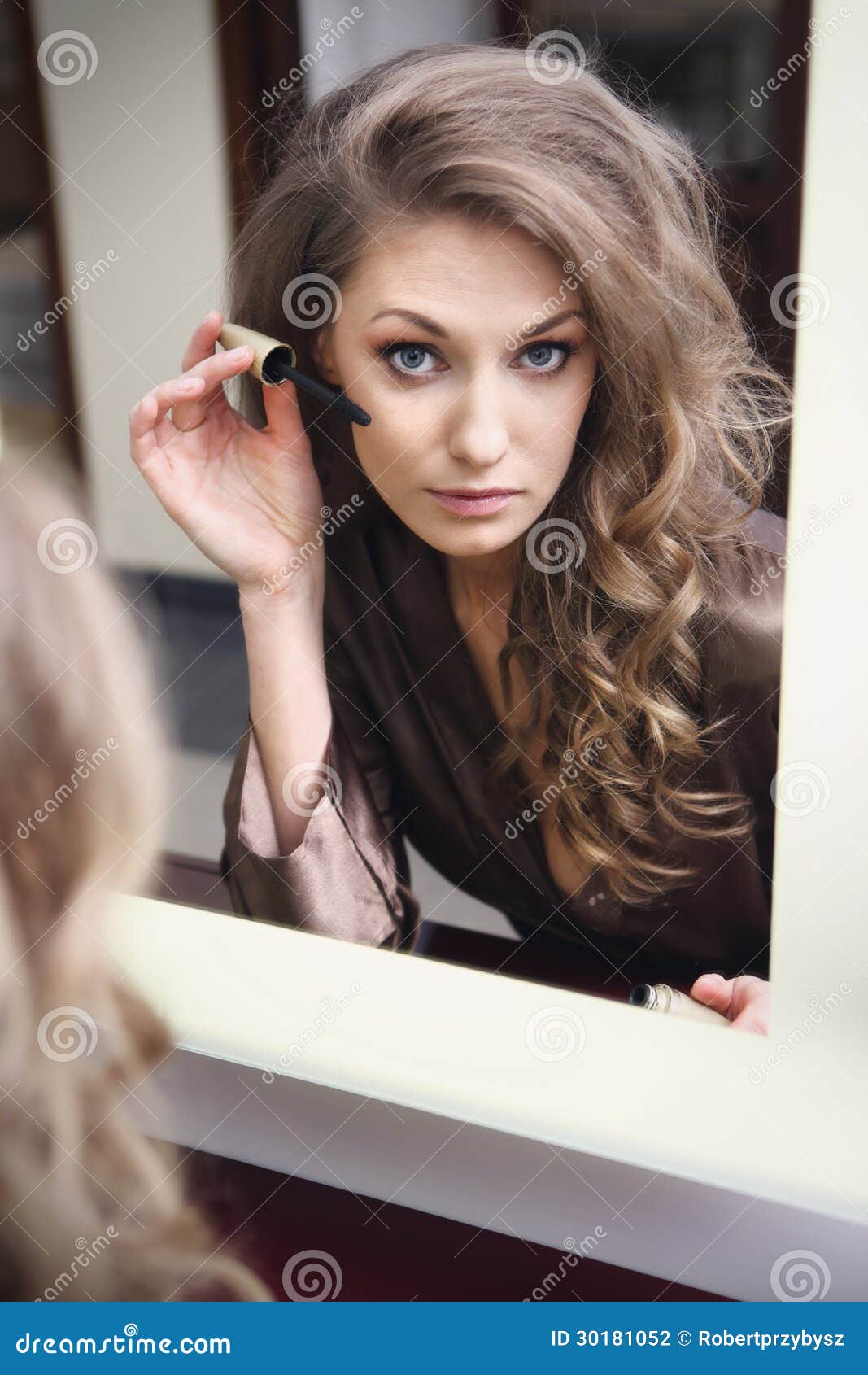 Beautiful girl does makeup stock photo. Image of clean - 30181052