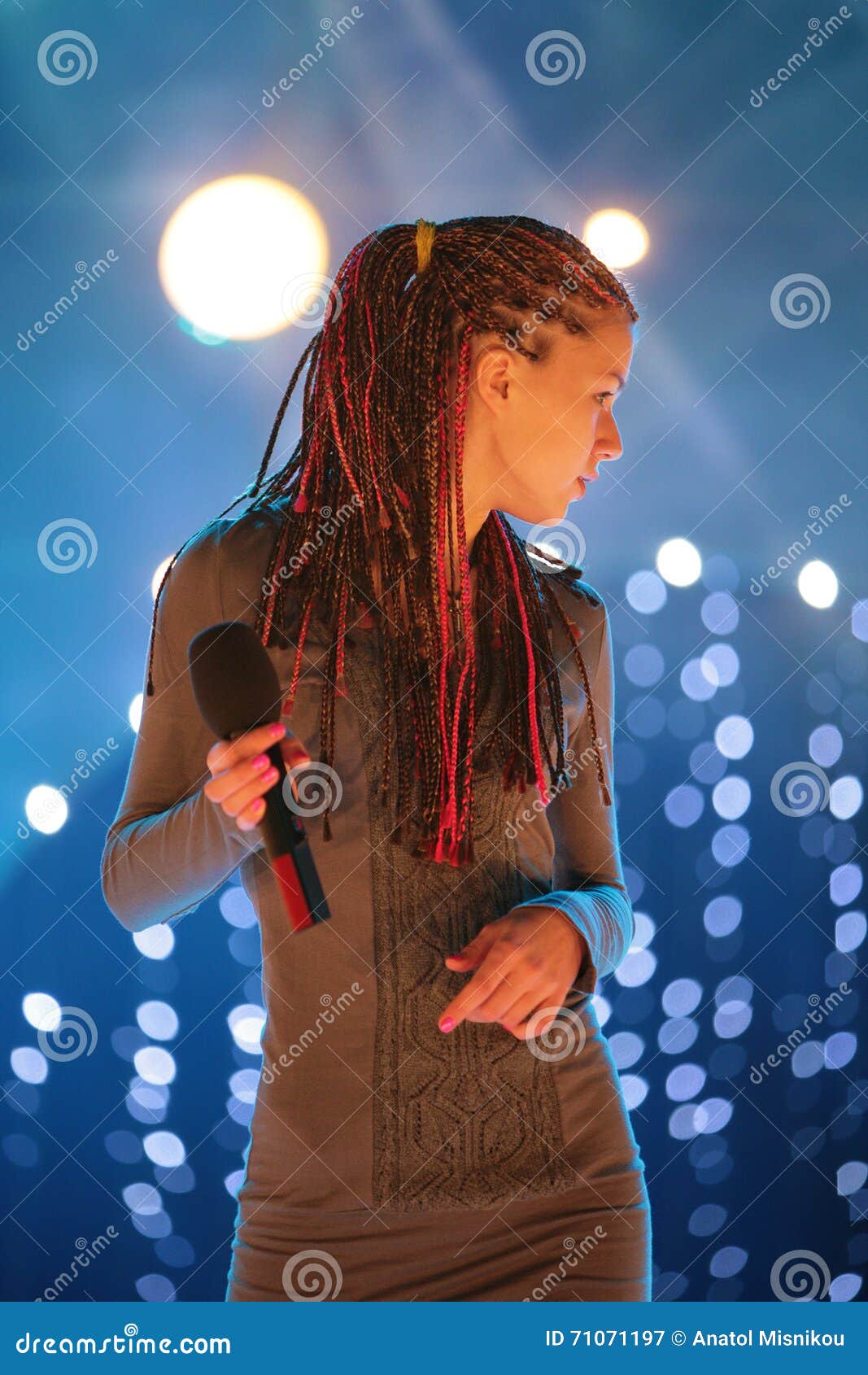 Young Beautiful Girl with a Microphone in Hand Stock Image - Image of ...