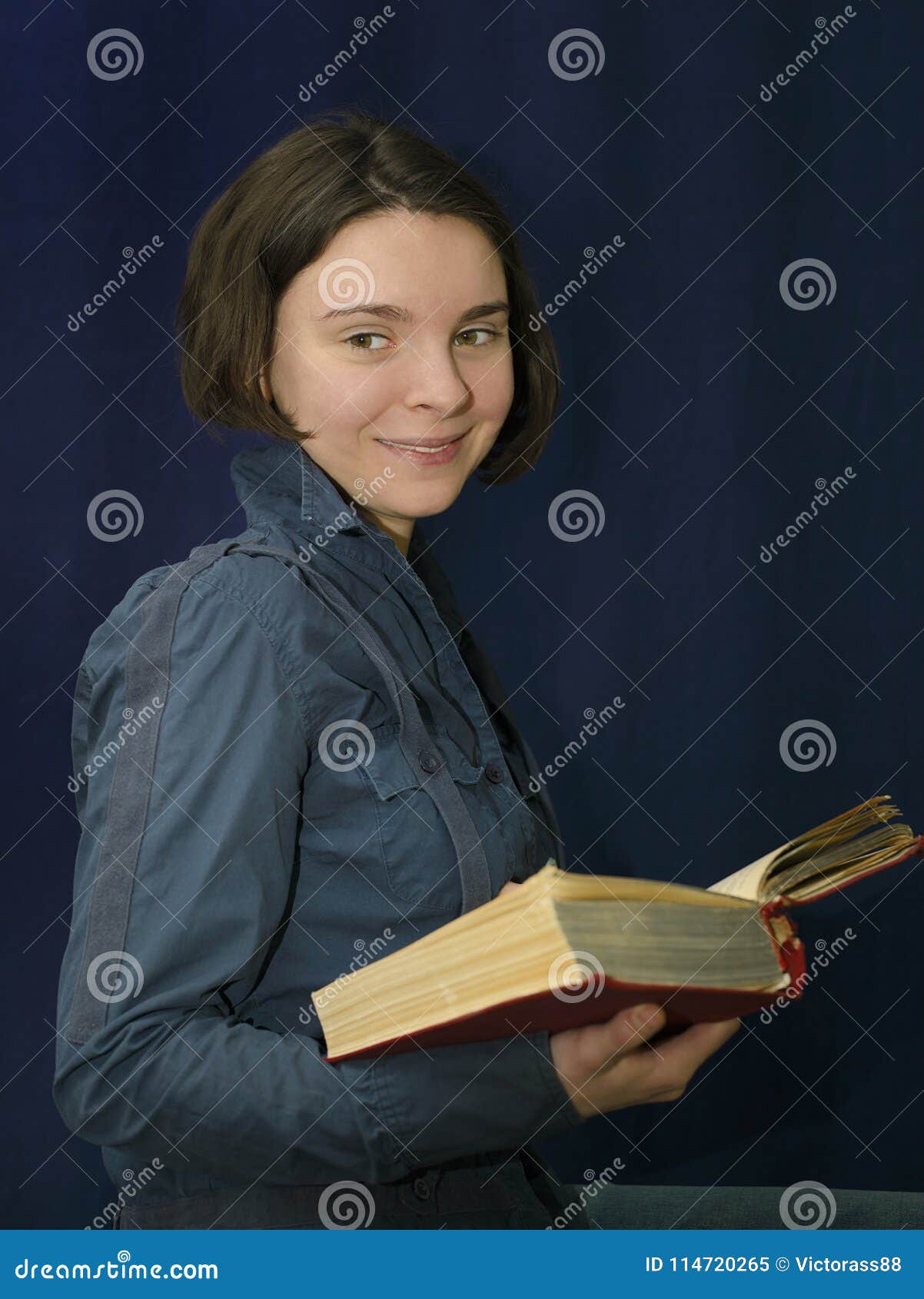 Girl Posing with Book stock image. Image of portrait - 114720265