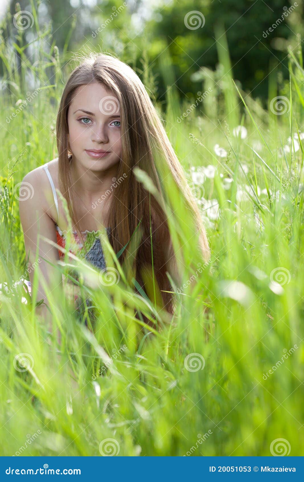 Young Beautiful Girl Siting in the Grass Stock Image - Image of field ...