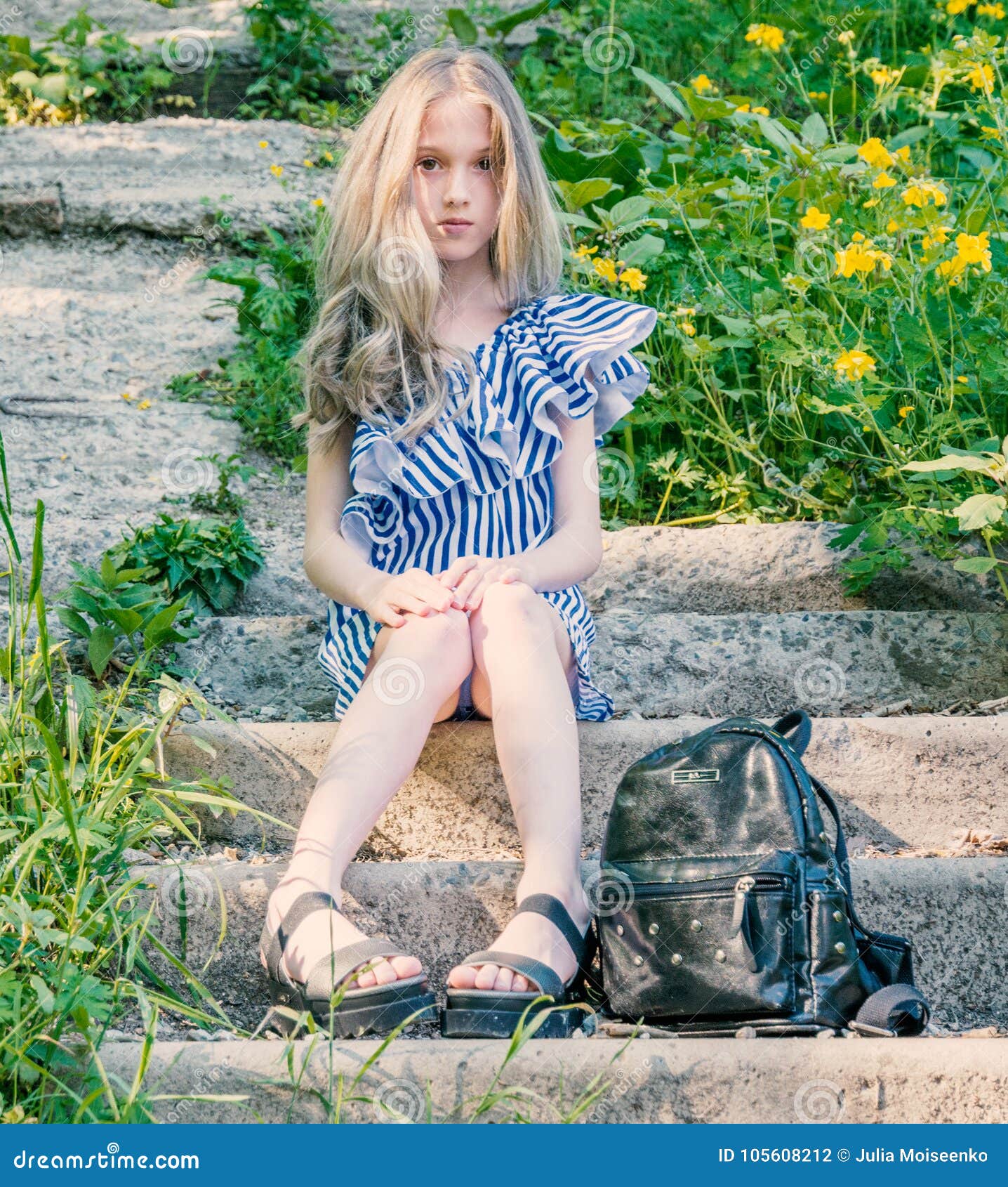 Young Beautiful Girl Sitting on the Stairs in the Park with Flower ... Young Beautiful Girl Sitting on the Stairs in the Park with Flower ...