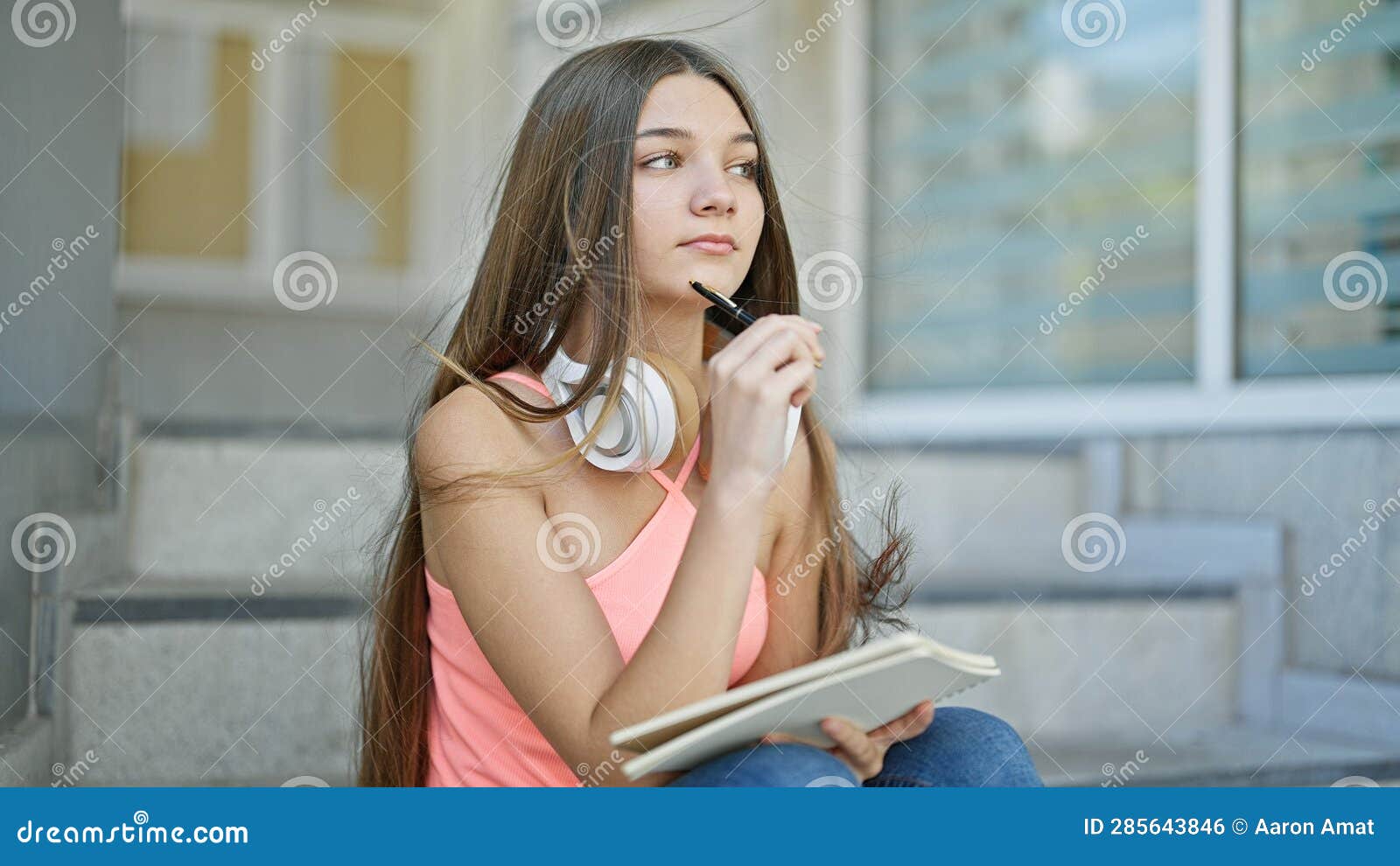 Young Beautiful Girl Student Taking Notes Sitting on Stairs Thinking at ...