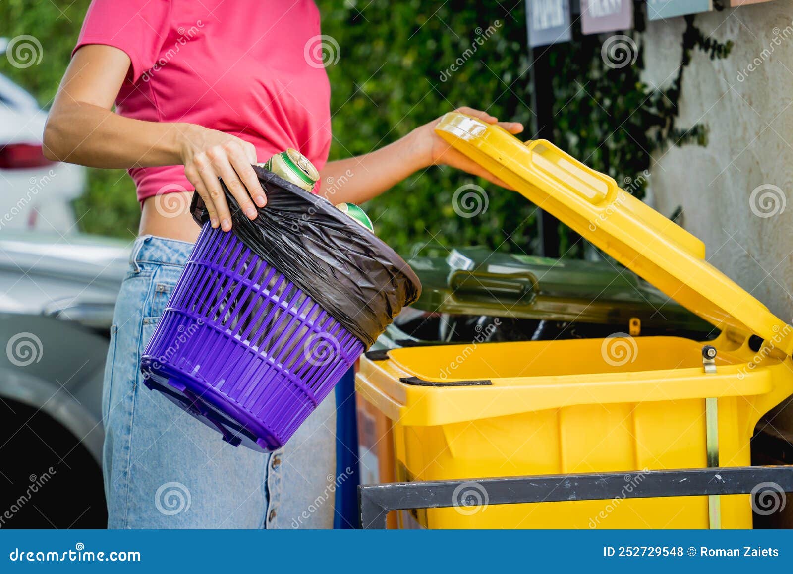 A Young Beautiful Girl Throws Sorted Garbage into Special Bins Stock ...