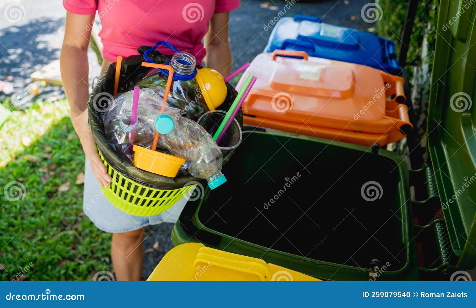A Young Beautiful Girl Throws Sorted Garbage into Special Bins Stock ...