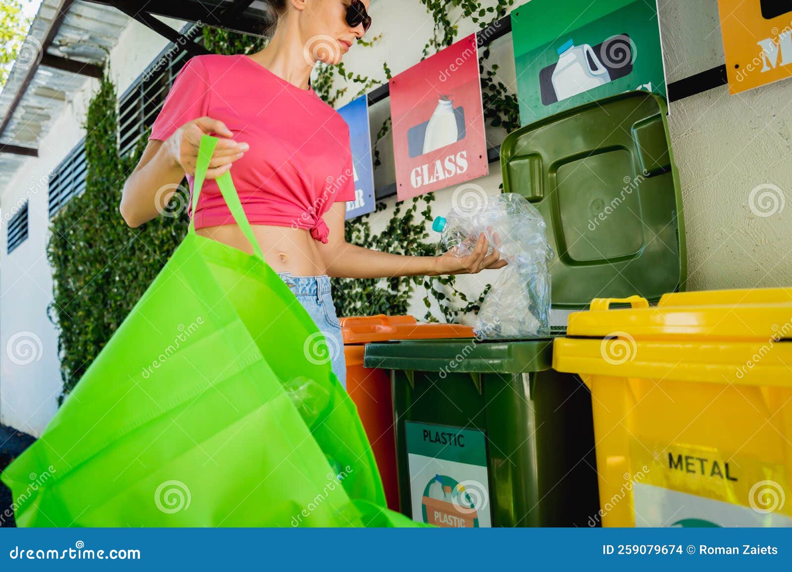 A Young Beautiful Girl Throws Sorted Garbage into Special Bins Stock ...