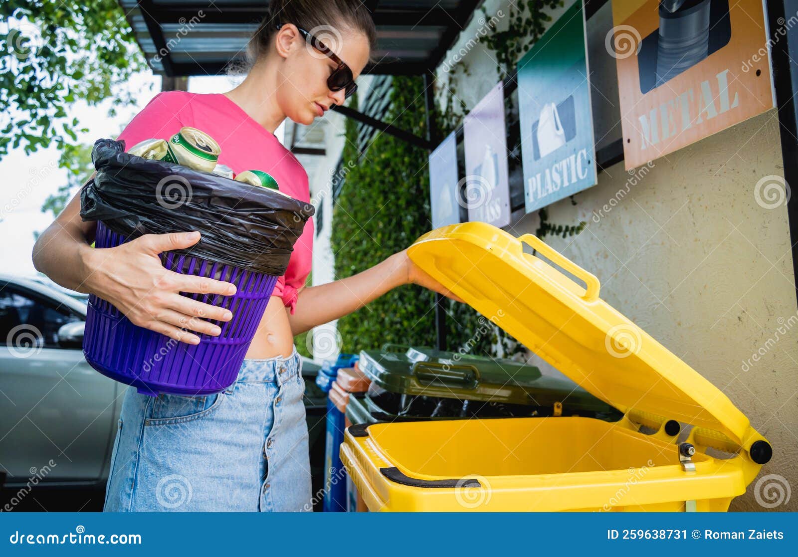 A Young Beautiful Girl Throws Sorted Garbage into Special Bins Stock ...