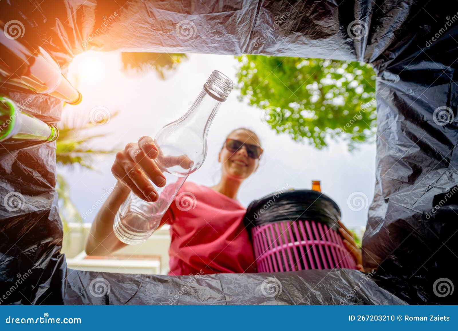 A Young Beautiful Girl Throws Sorted Garbage into Special Bins Stock ...