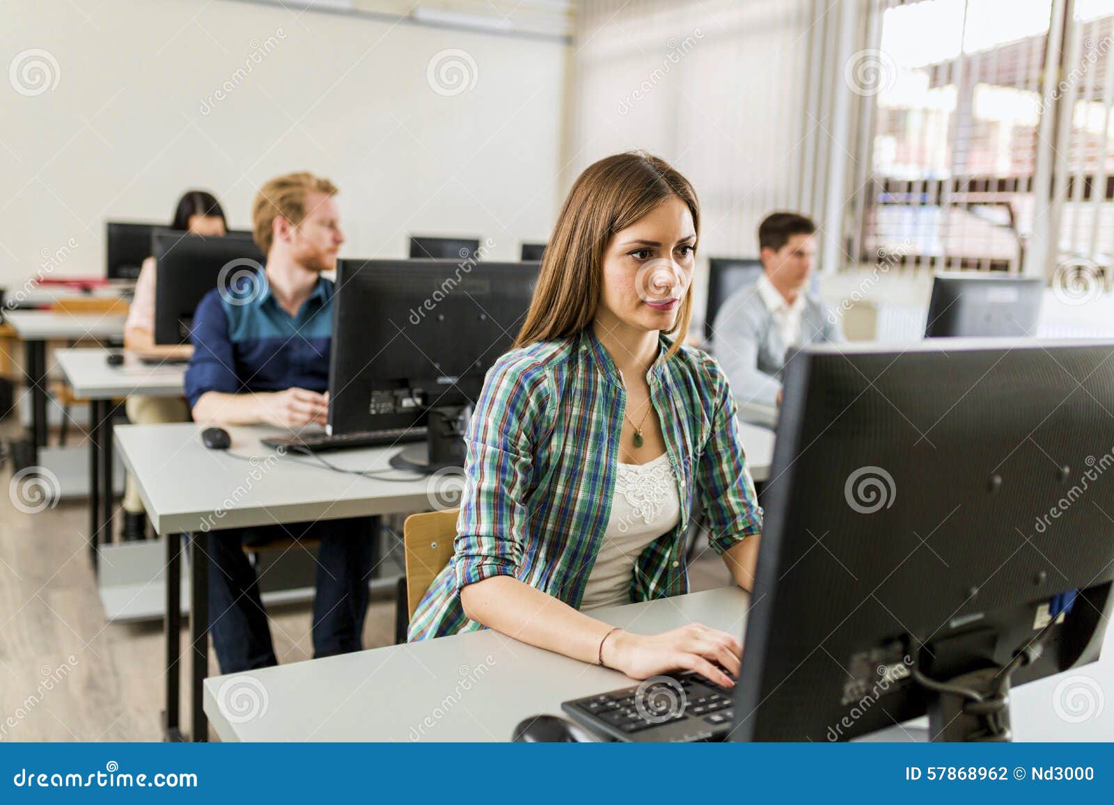 Young Beautiful Girl Working on a Computer Stock Photo - Image of face ...