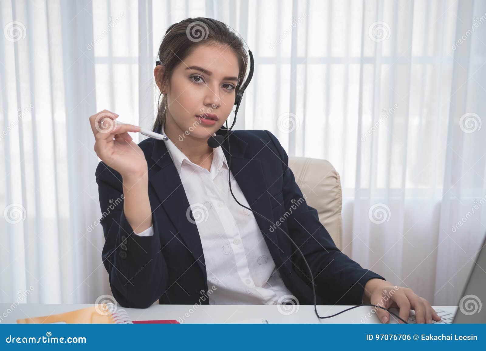 Young Beautiful Girl Working at a Laptop in a Small Medium Enterprise ...