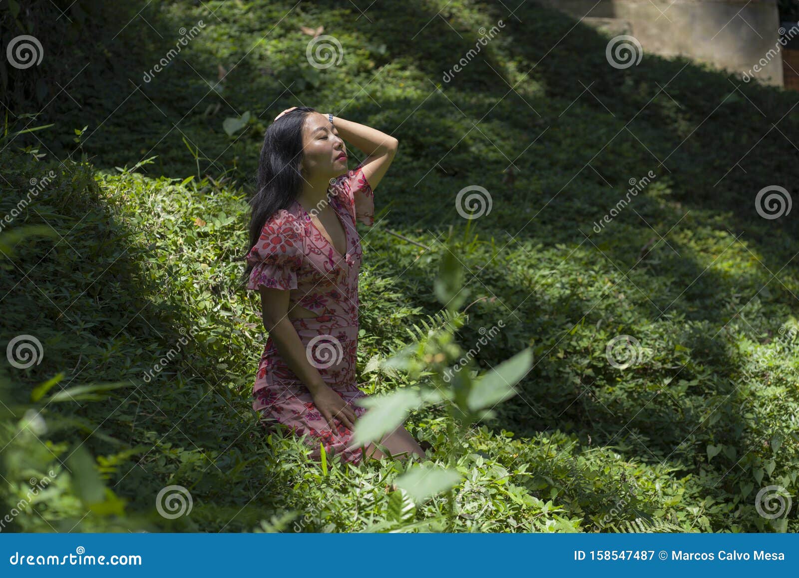 Young Beautiful And Happy Asian Chinese Woman In Stylish Dress Enjoying
