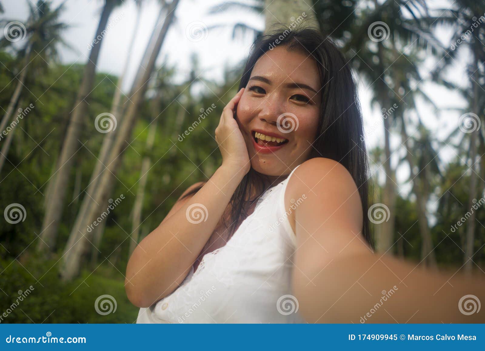 Young Beautiful And Happy Asian Chinese Woman Taking Selfie Portrait
