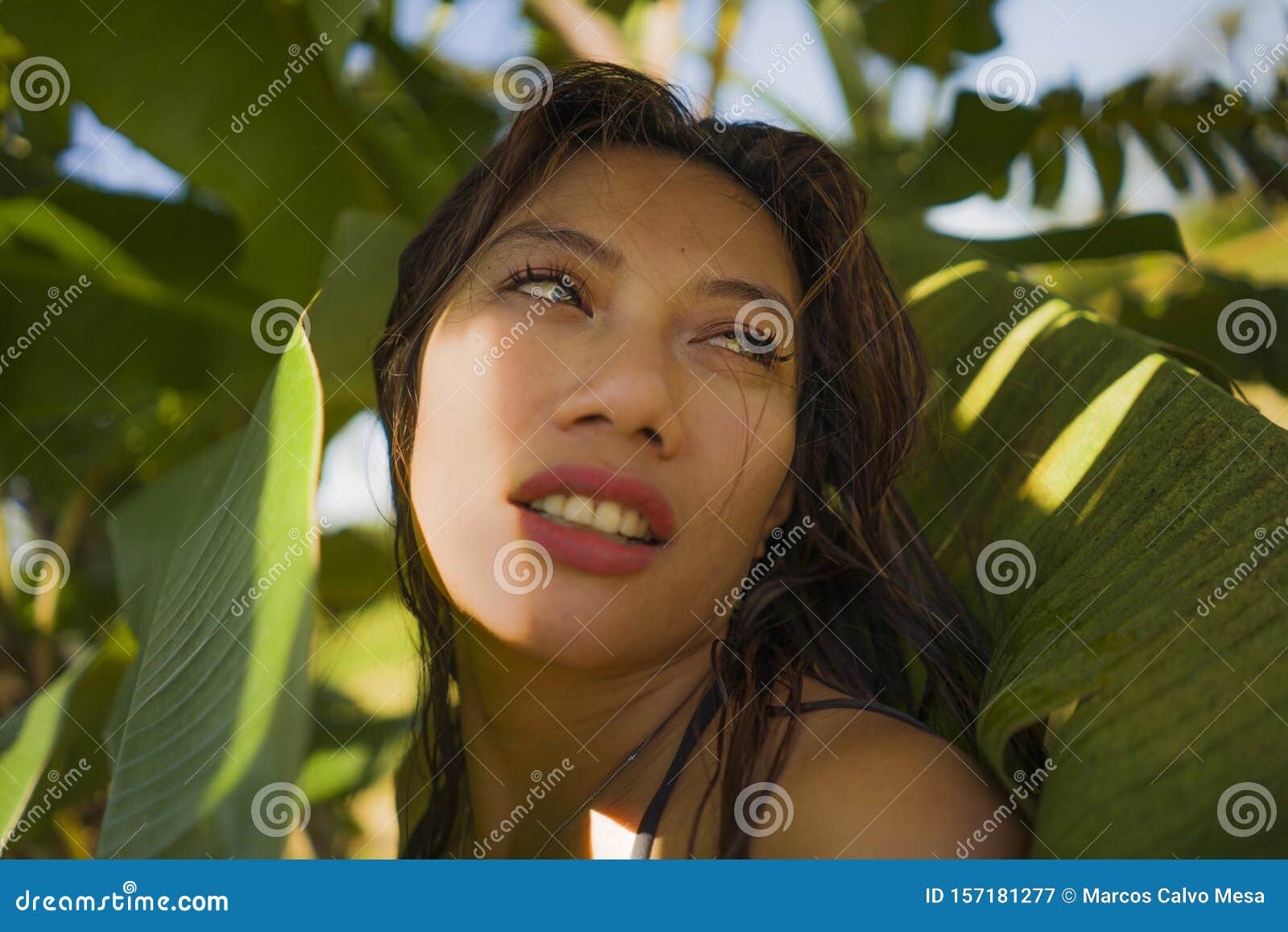 Young Beautiful And Happy Asian Indonesian Woman In Bikini Posing