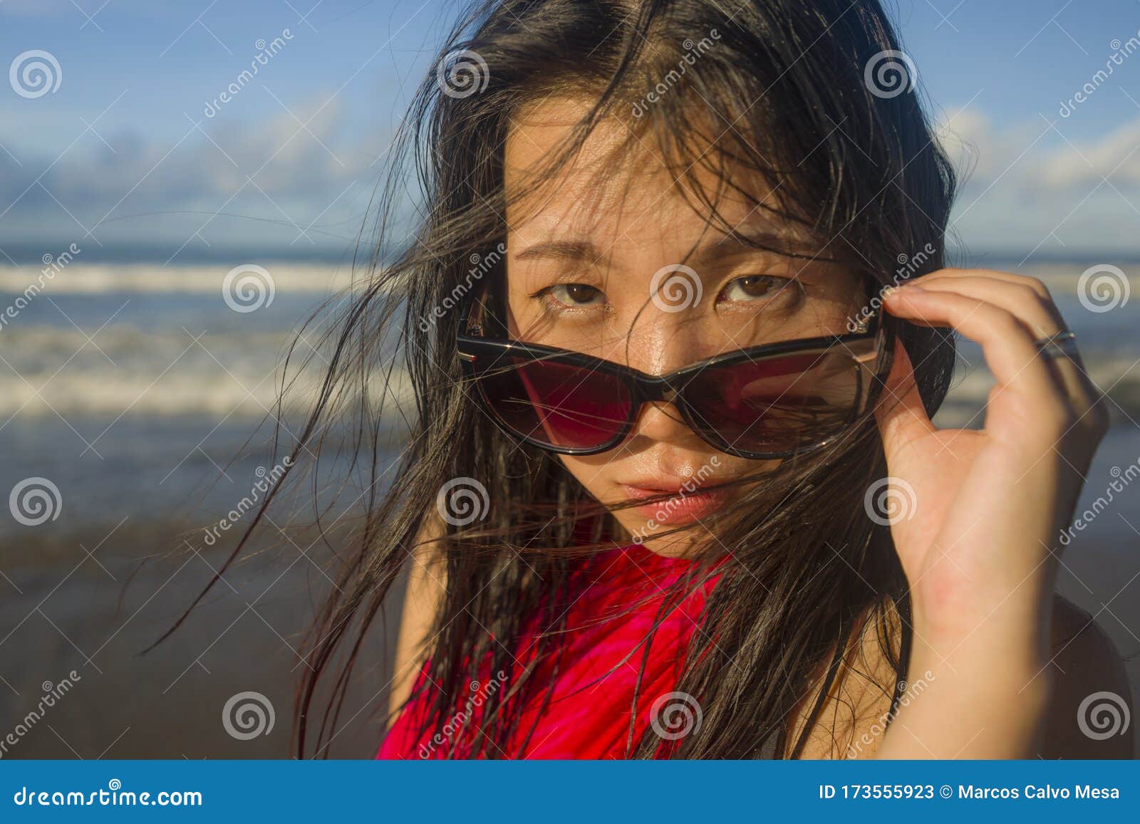 Young Beautiful And Happy Asian Japanese Woman In Sunglasses Wearing