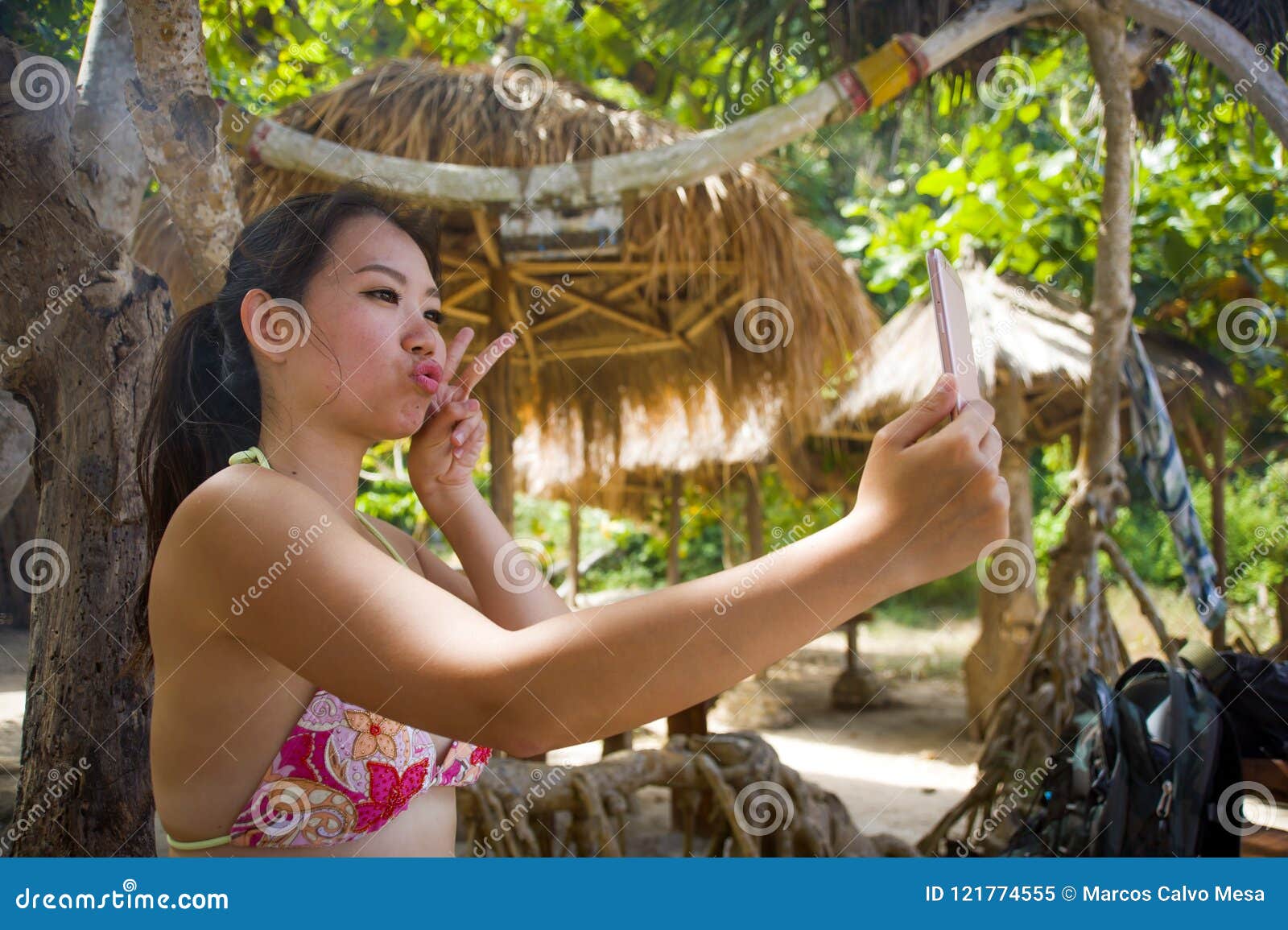 Young Beautiful And Happy Asian Korean Woman Taking Self Portrait