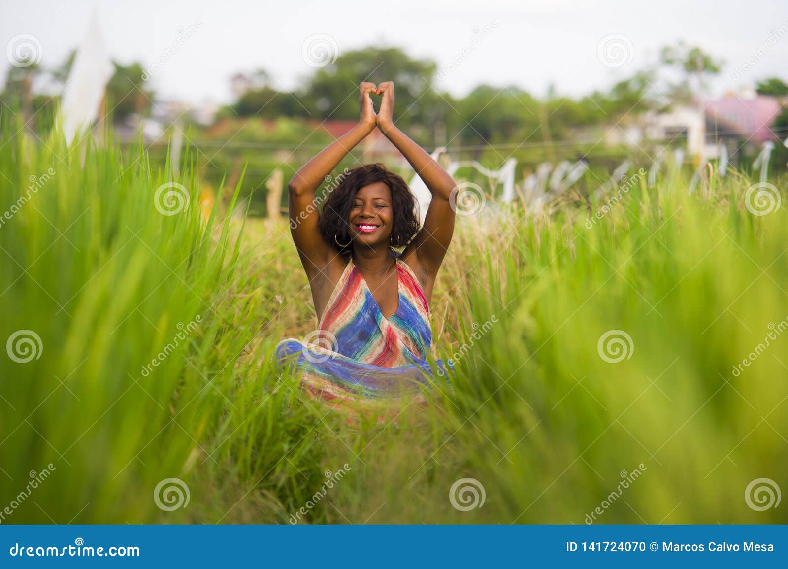 Young Beautiful And Happy Black African American Woman Sitting At Rive