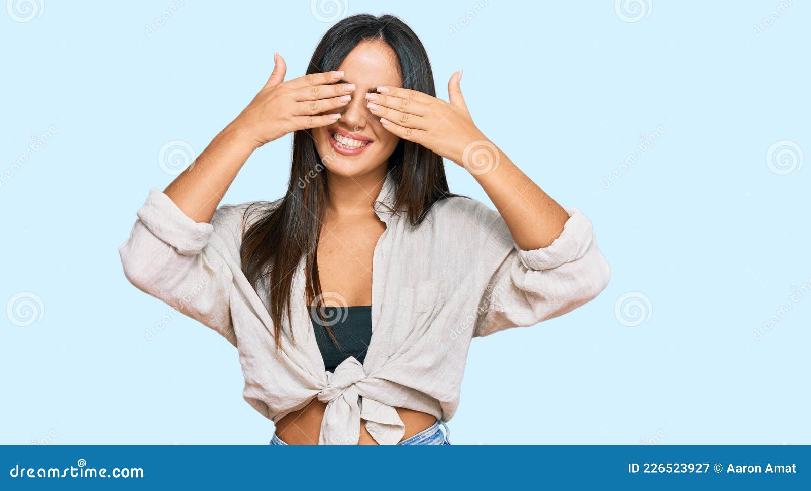 Young Beautiful Hispanic Girl Wearing Casual Clothes Covering Eyes With