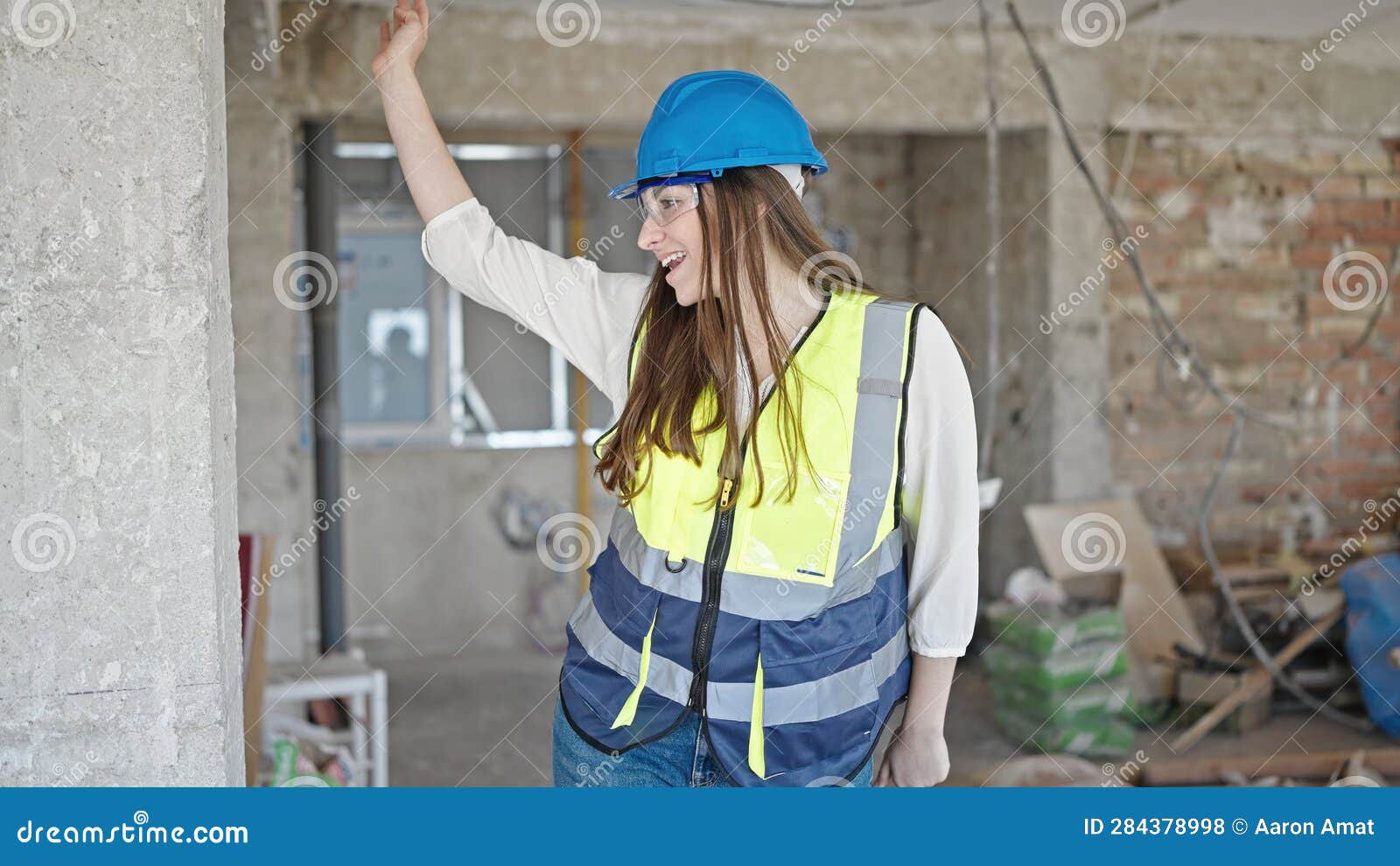 Young Beautiful Hispanic Woman Builder Smiling Confident Dancing at ...