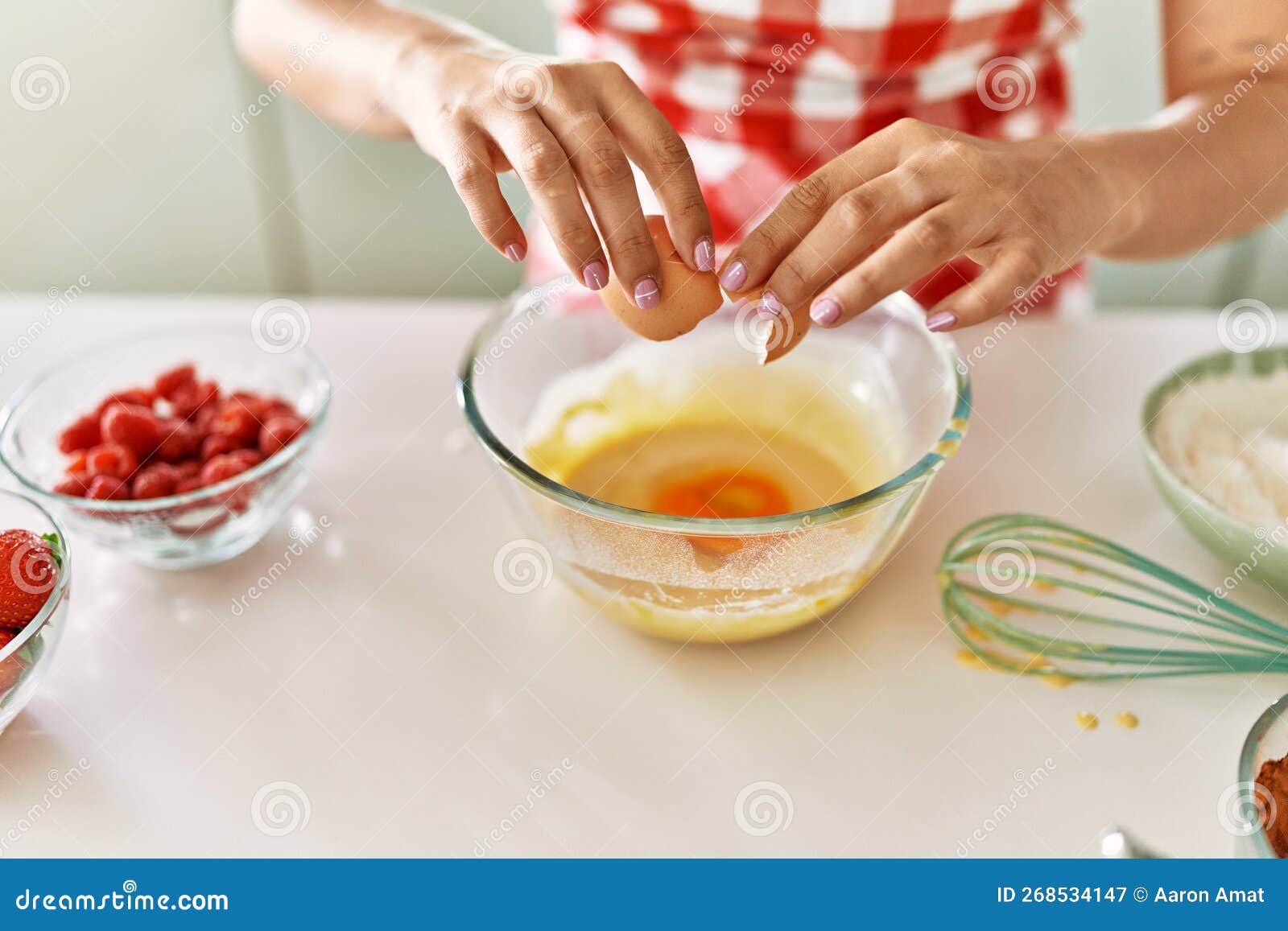 Young Beautiful Hispanic Woman Pouring Egg on Bowl at the Kitchen Stock ...