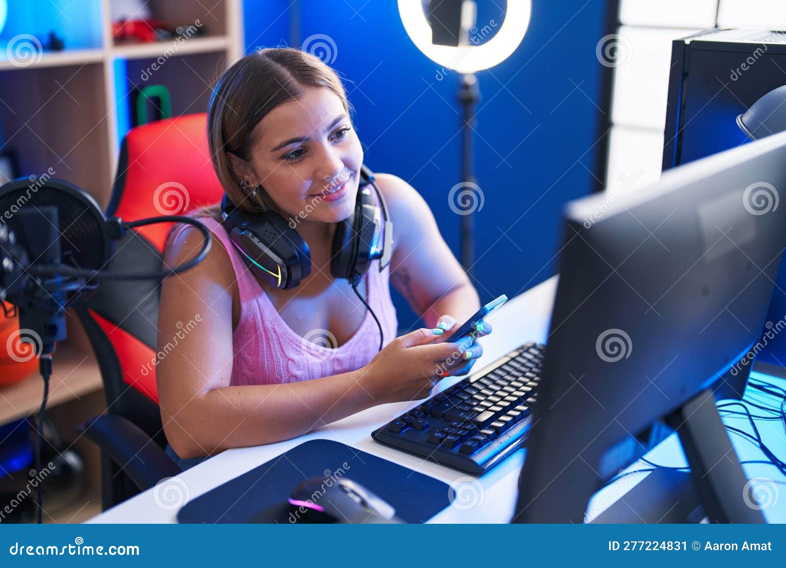 Young Beautiful Hispanic Woman Streamer Using Computer and Smartphone ...