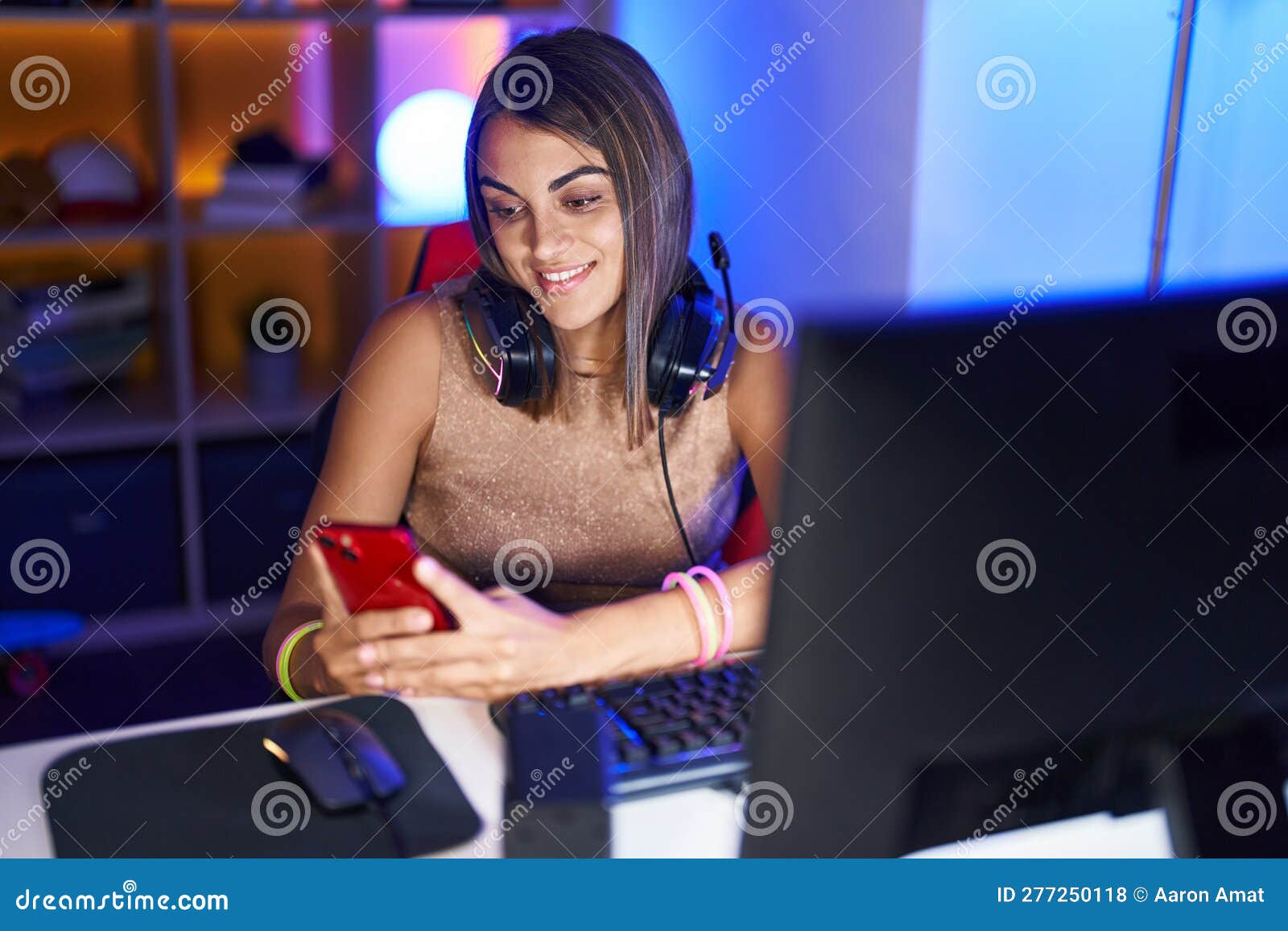 Young Beautiful Hispanic Woman Streamer Using Computer and Smartphone ...