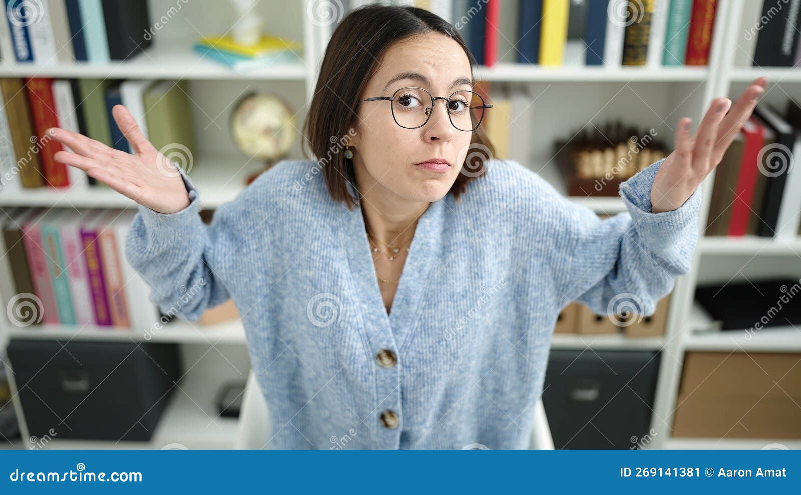 Young Beautiful Hispanic Woman Student Sitting on Table with I Dont ...