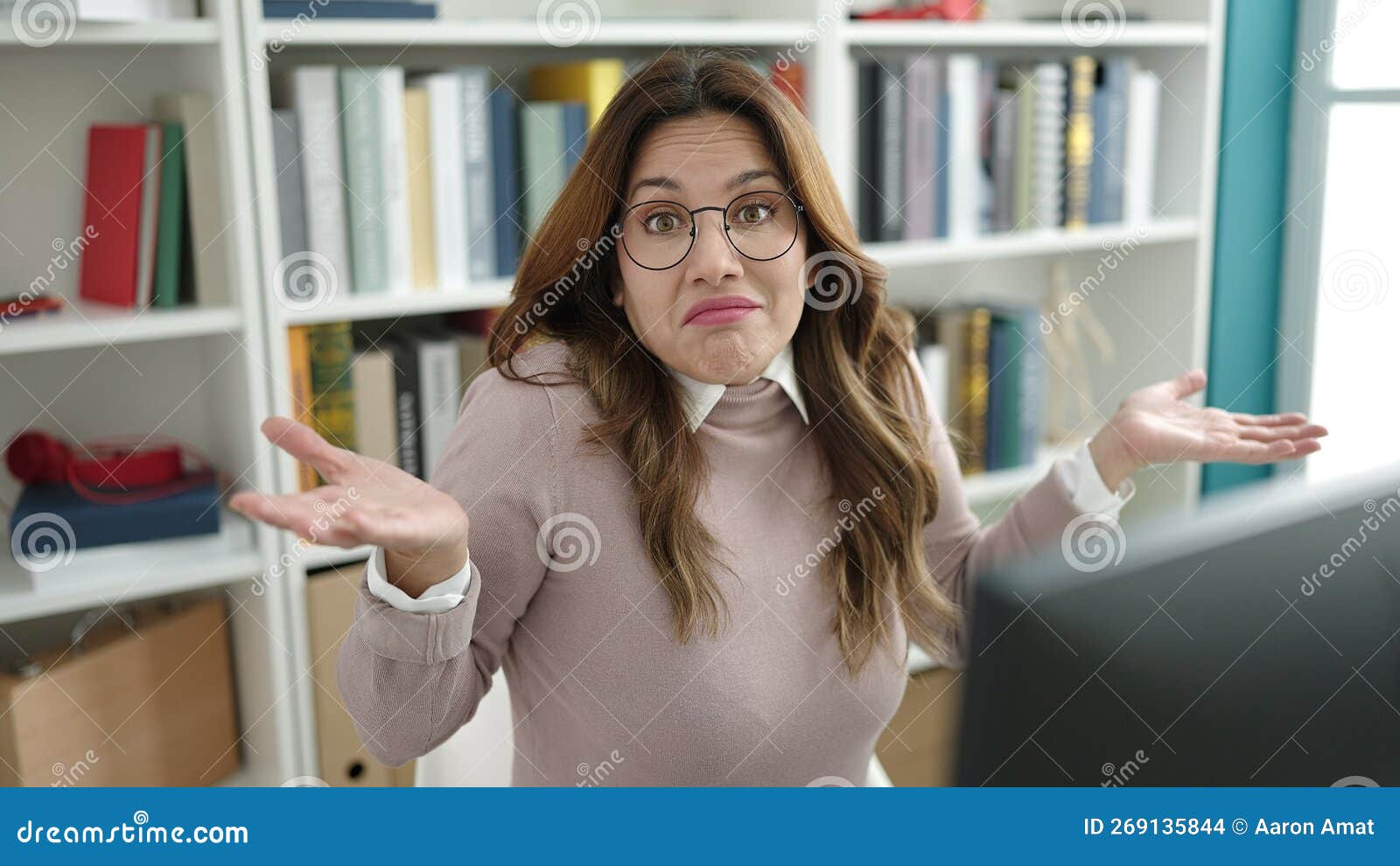 Young Beautiful Hispanic Woman Student Using Computer with I Dont Know ...