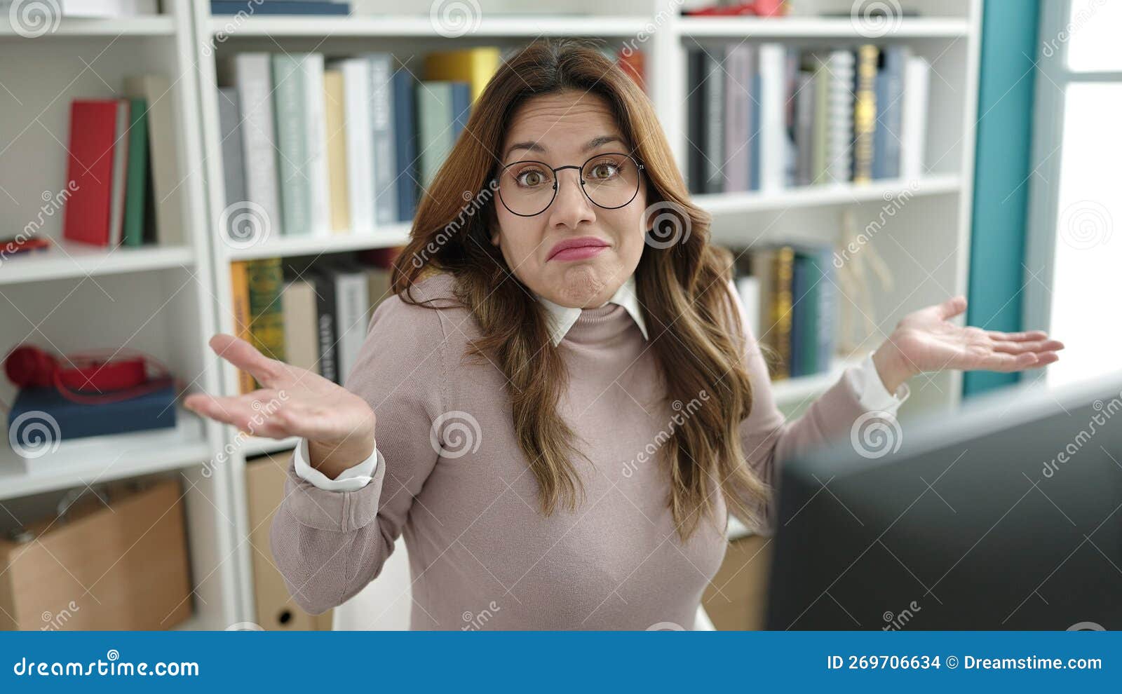 Young Beautiful Hispanic Woman Student Using Computer with I Dont Know ...