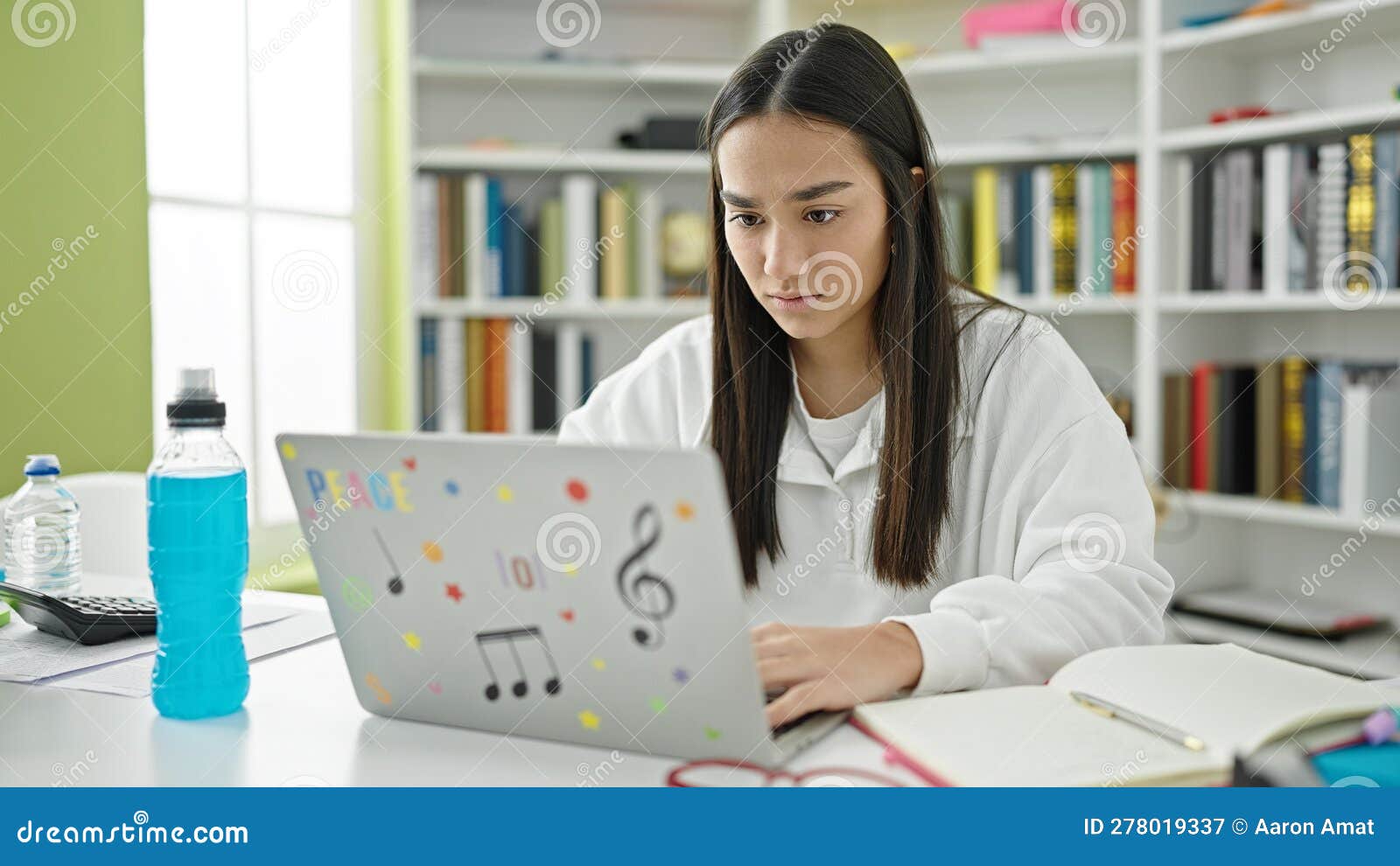 Young Beautiful Hispanic Woman Student Using Laptop Studying at ...