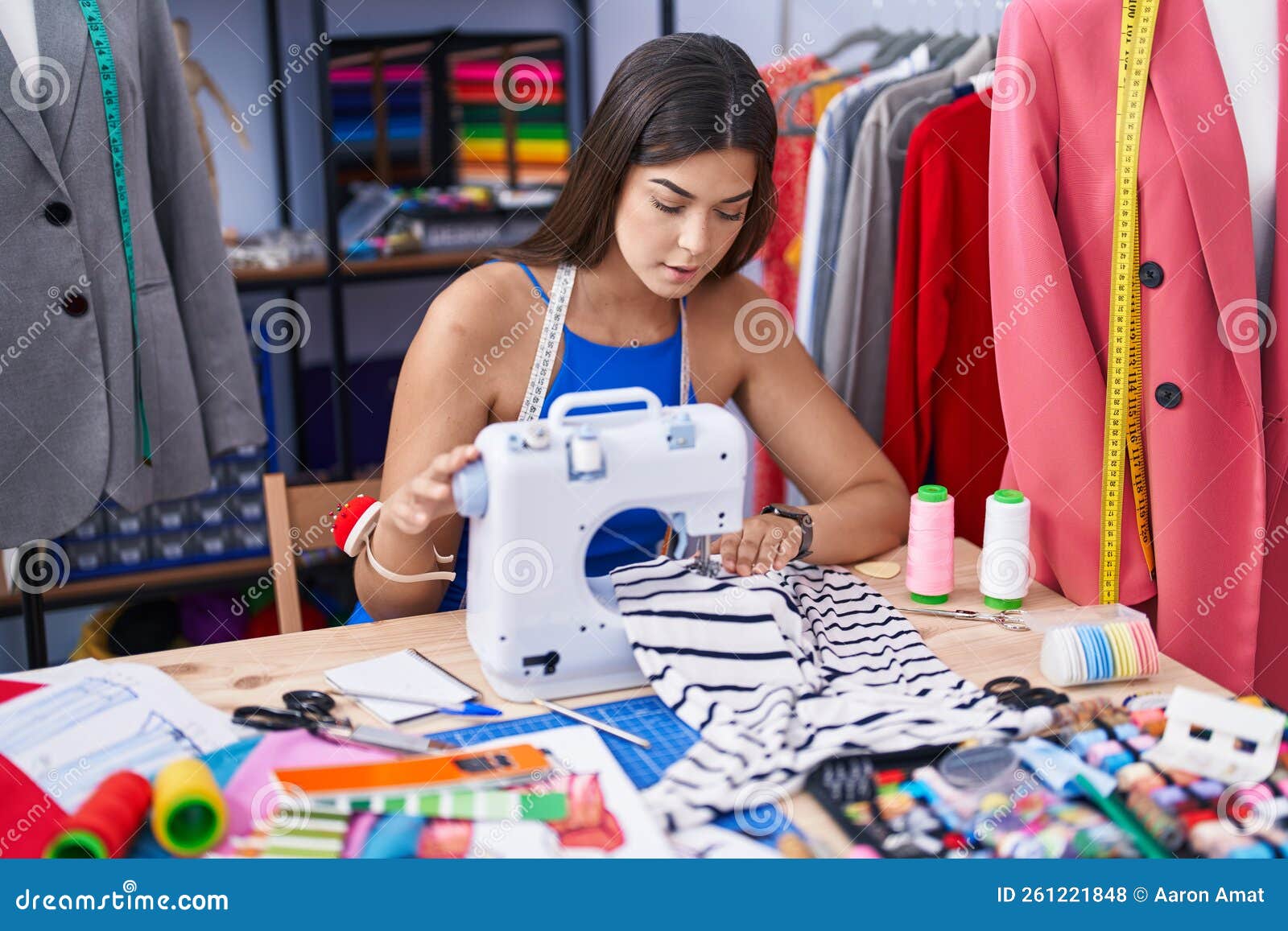Young Beautiful Hispanic Woman Tailor Using Sewing Machine at Tailor ...