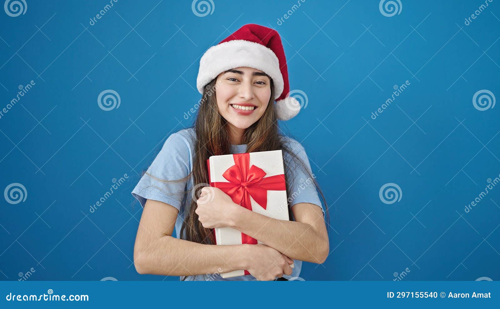 Young Beautiful Hispanic Woman Wearing Christmas Hat Hugging T Over
