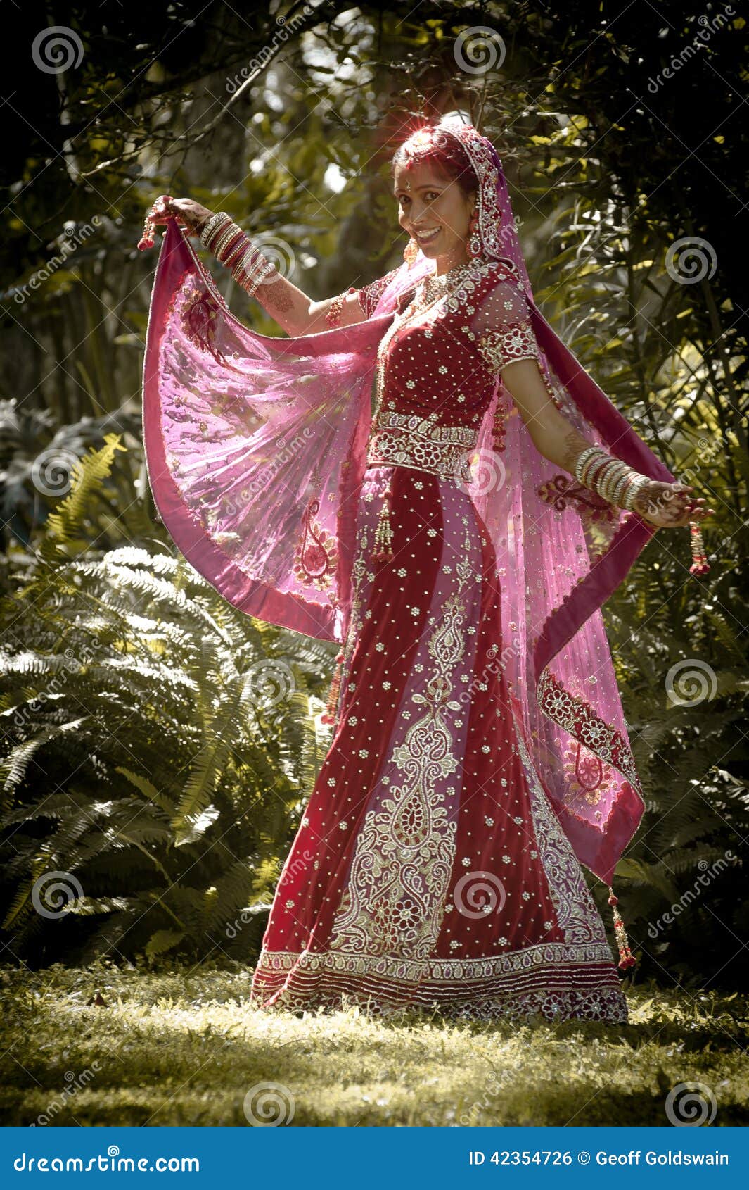 Young Beautiful Indian Hindu Bride Dancing Under Tree Stock Photo ...