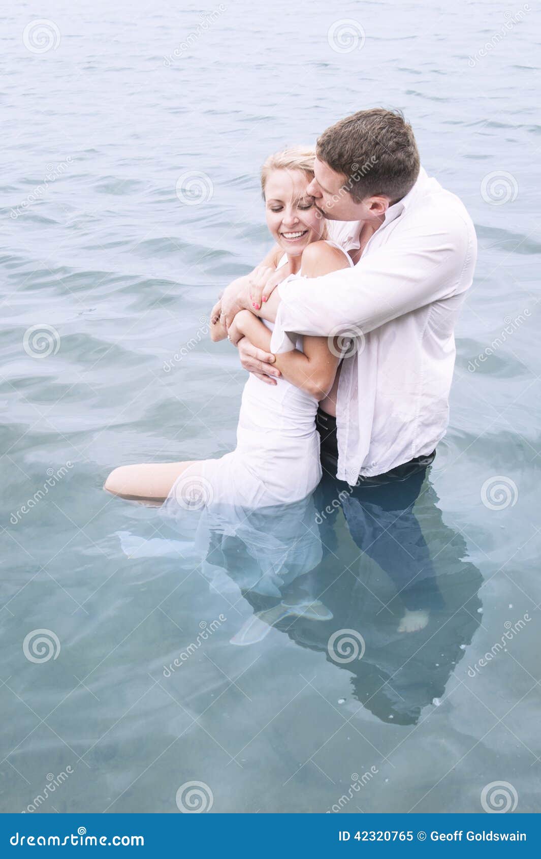 Young Beautiful Lovers in Pool of Water Sharing an Intimate Moment ...