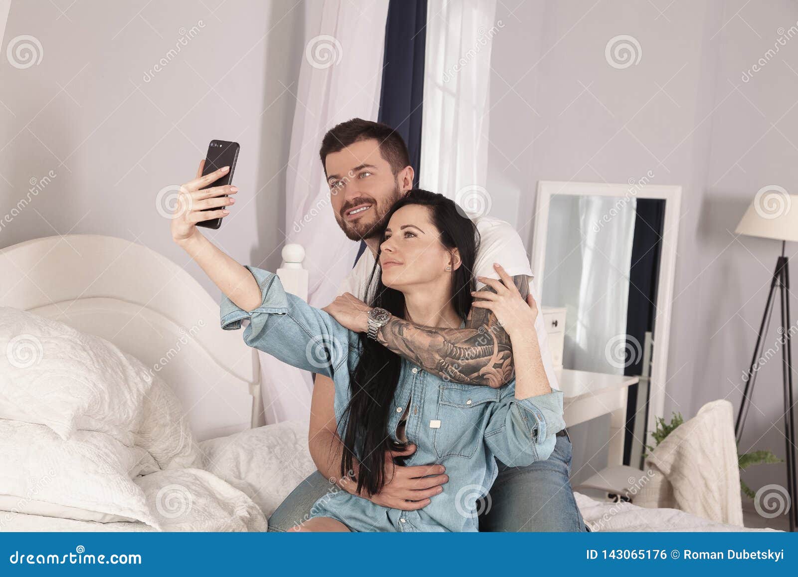 Young Beautiful And Loving Couple Take Selfie Picture On Smartphone