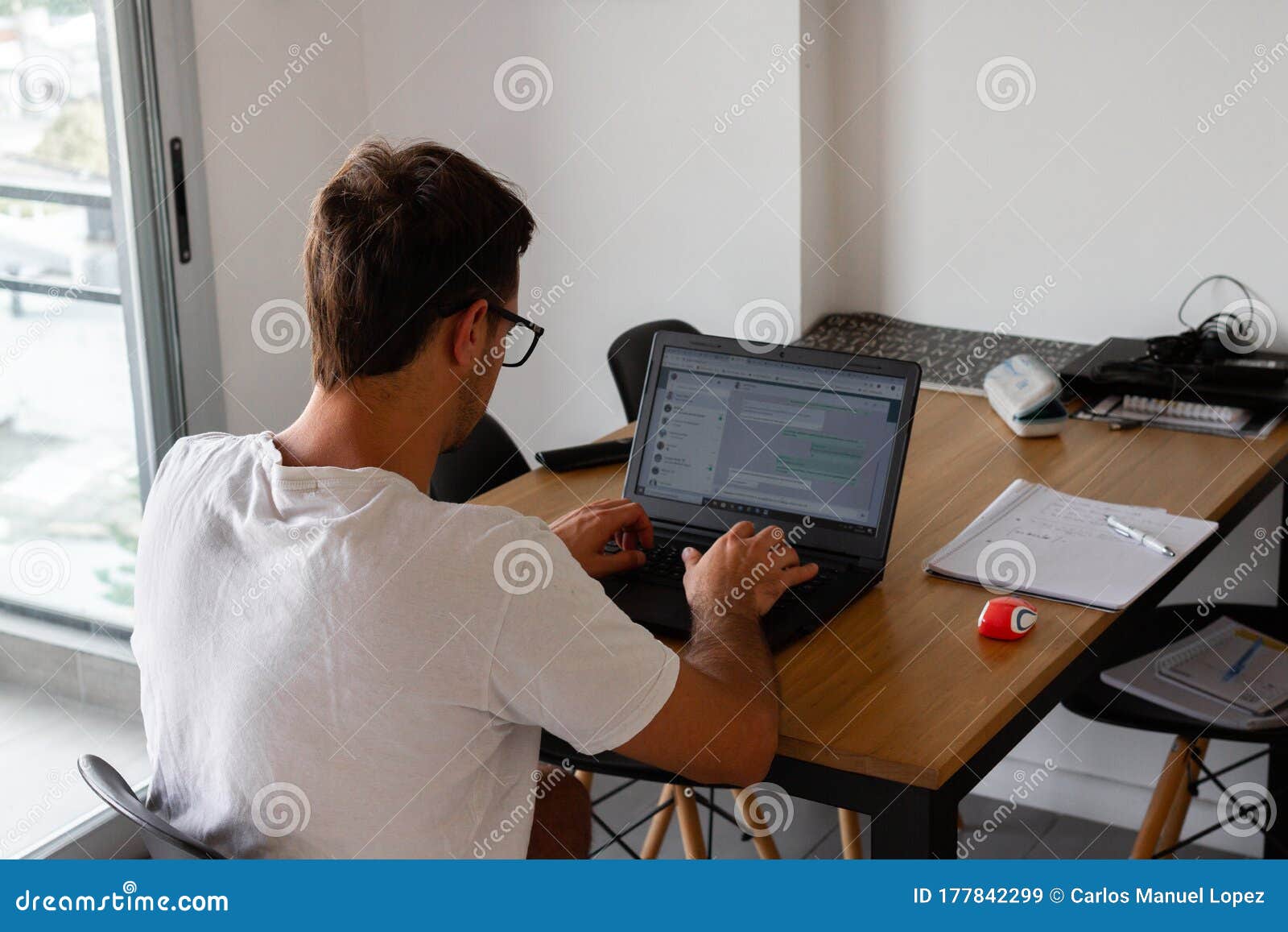 Young Man Telecommuting from Home Stock Image - Image of young ...