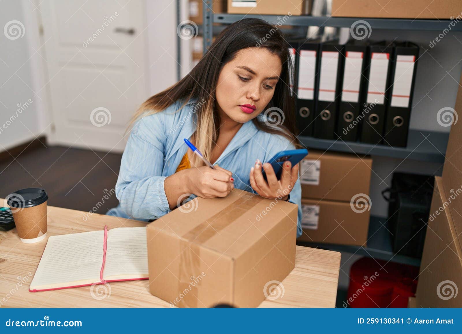 Young Beautiful Plus Size Woman Ecommerce Business Worker Using ...