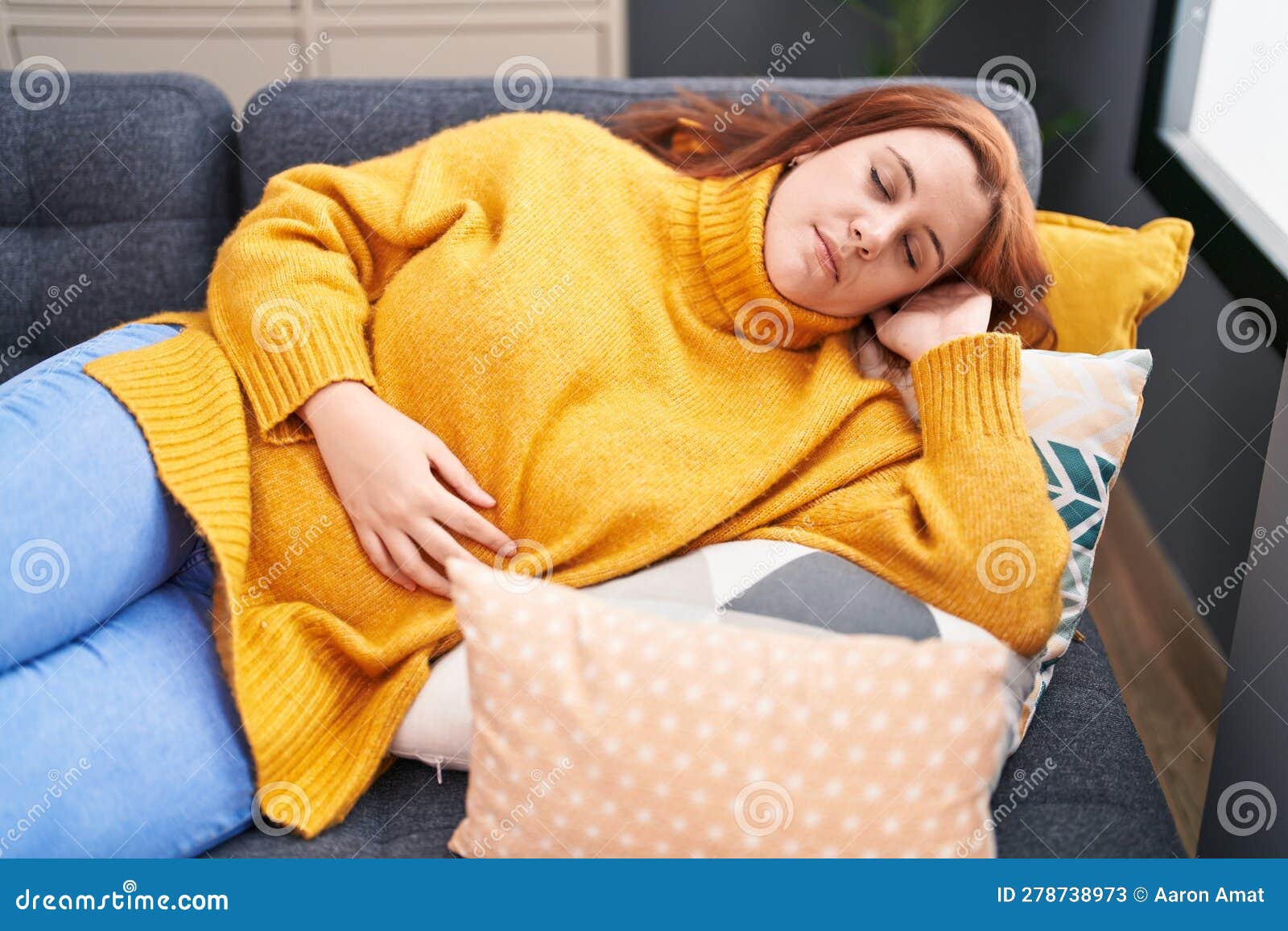 Young Beautiful Plus Size Woman Lying on Sofa Sleeping at Home Stock ...