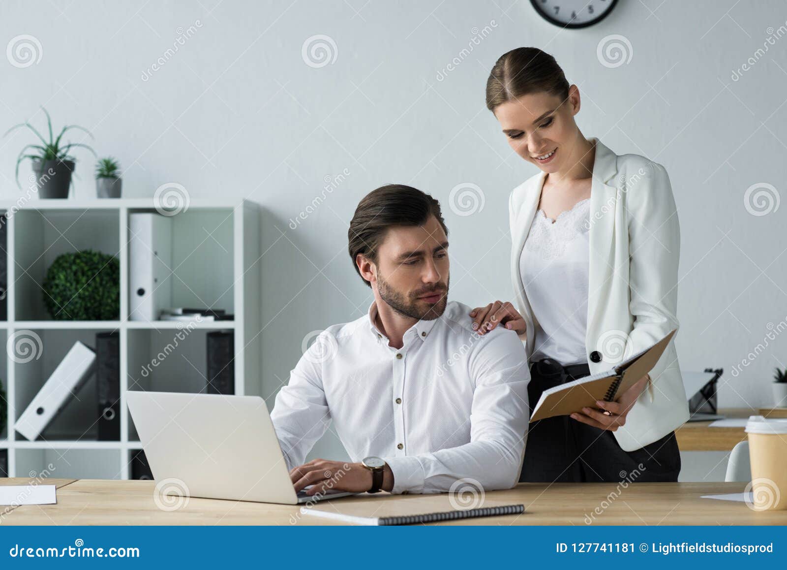 Young Beautiful Secretary Showing Notes To Boss Stock Image - Image of ...