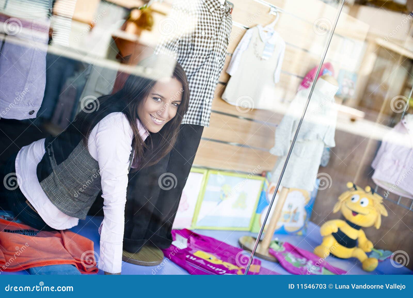 Young Beautiful Shop Assistant Stock Image - Image of clothing, hand ...