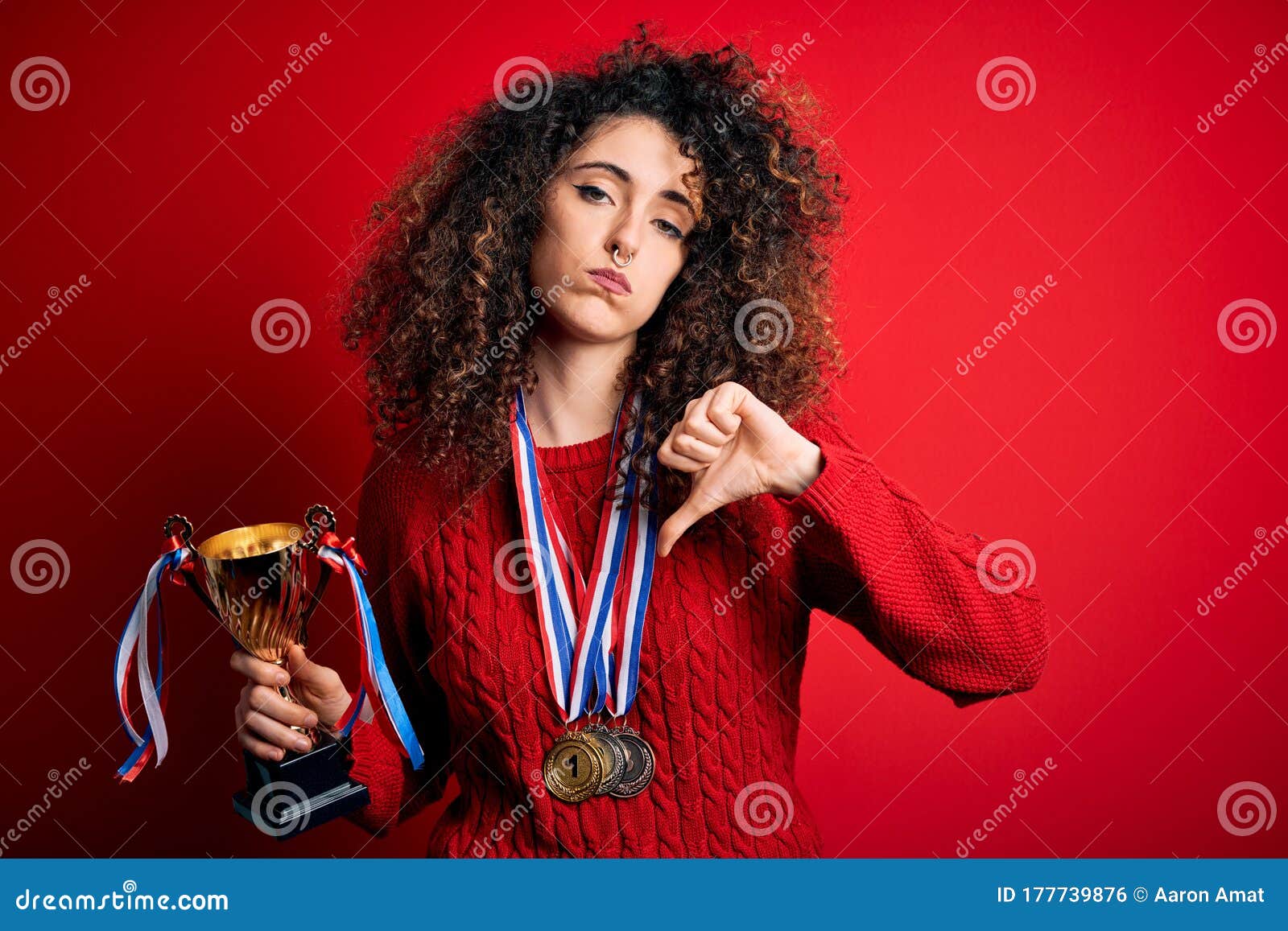 Young Beautiful Successful Woman with Curly Hair and Piercing Holding ... Young Beautiful Successful Woman with Curly Hair and Piercing Holding ...