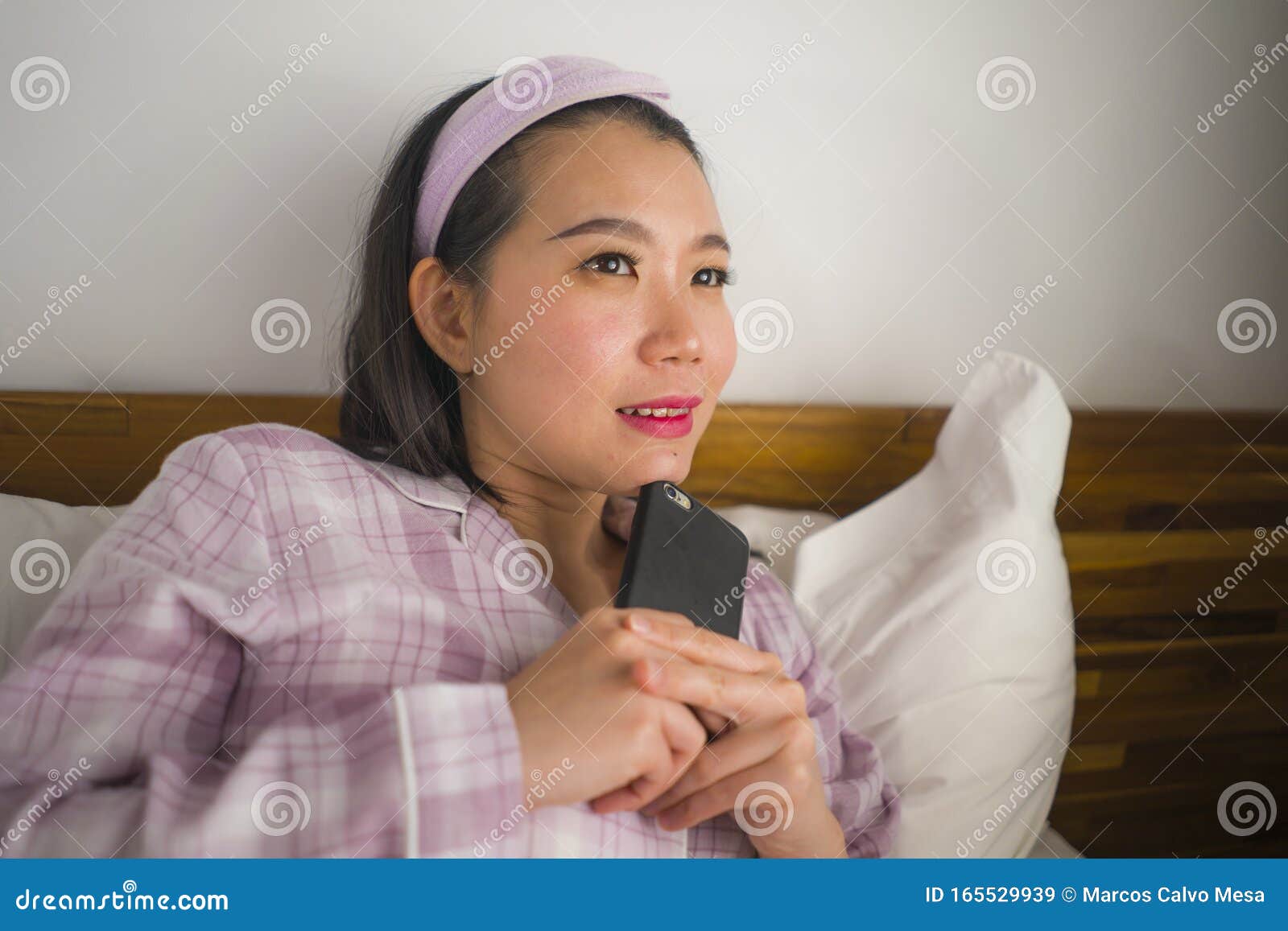 Young Beautiful And Sweet Asian Chinese Woman In Cute Pajamas Playful