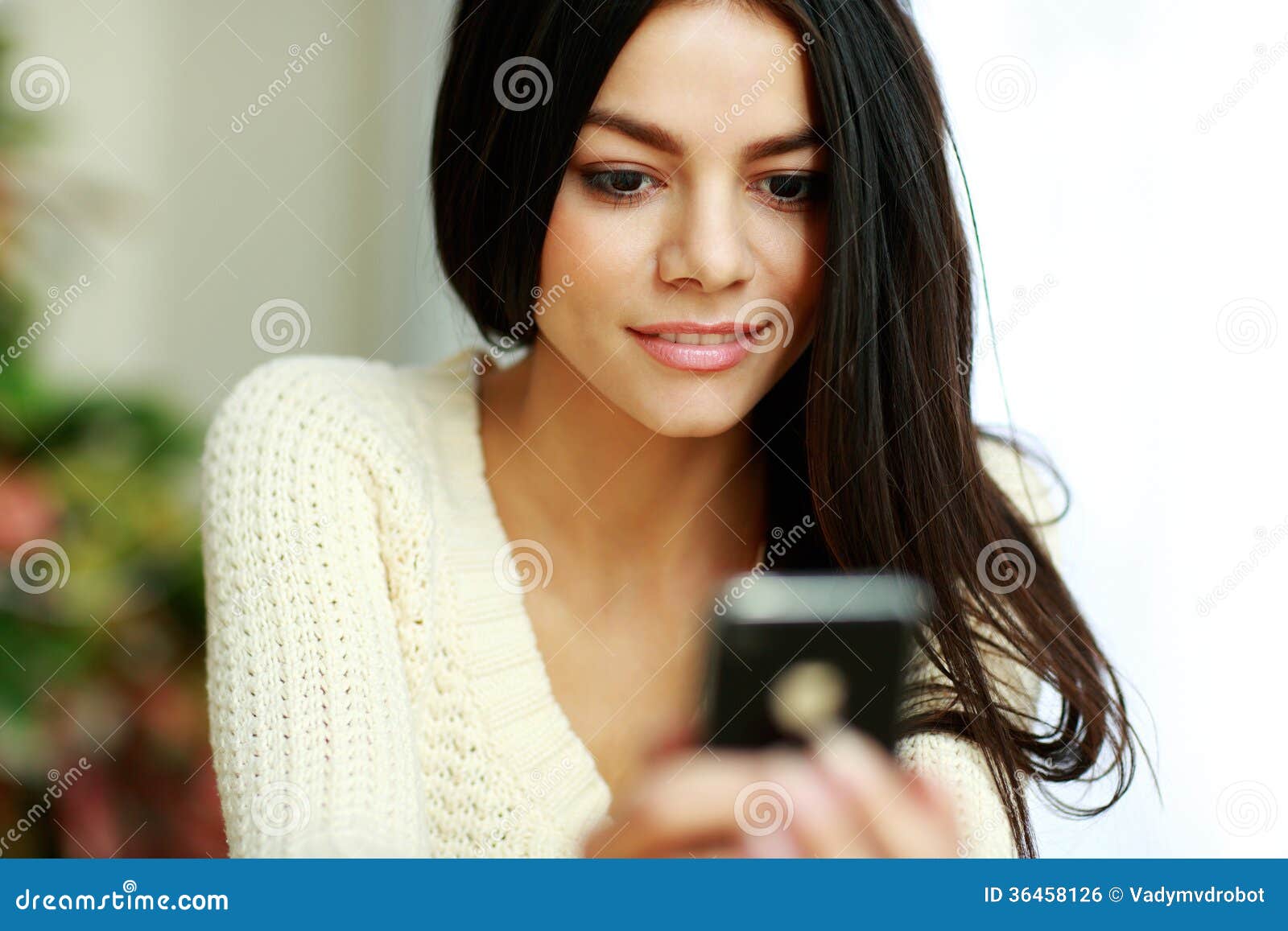 Young Beautiful Thoughtful Woman Using Smartphone Stock Photo - Image ...