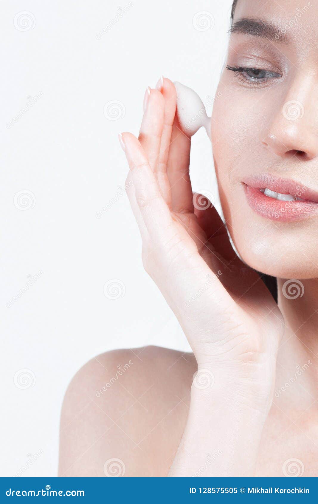 Young Beautiful Woman Applies Cream On Clean Perfect Skin Stock Image