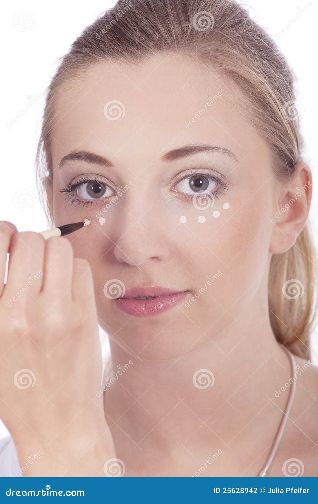 Young Beautiful Woman Applying Concealer on Face Stock Photo - Image of ...