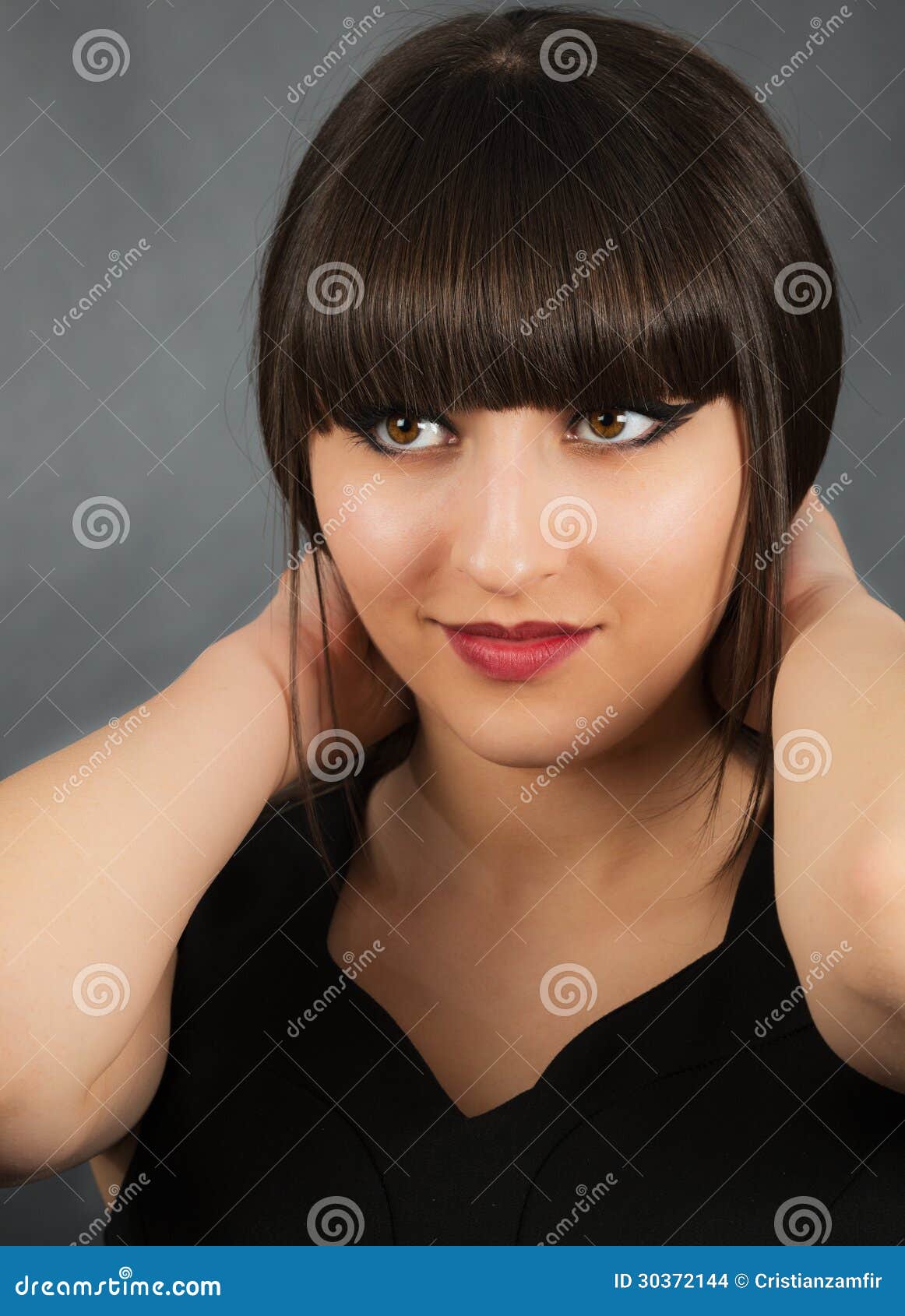 Young Beautiful Woman with Bangs in Studio Stock Photo - Image of ...